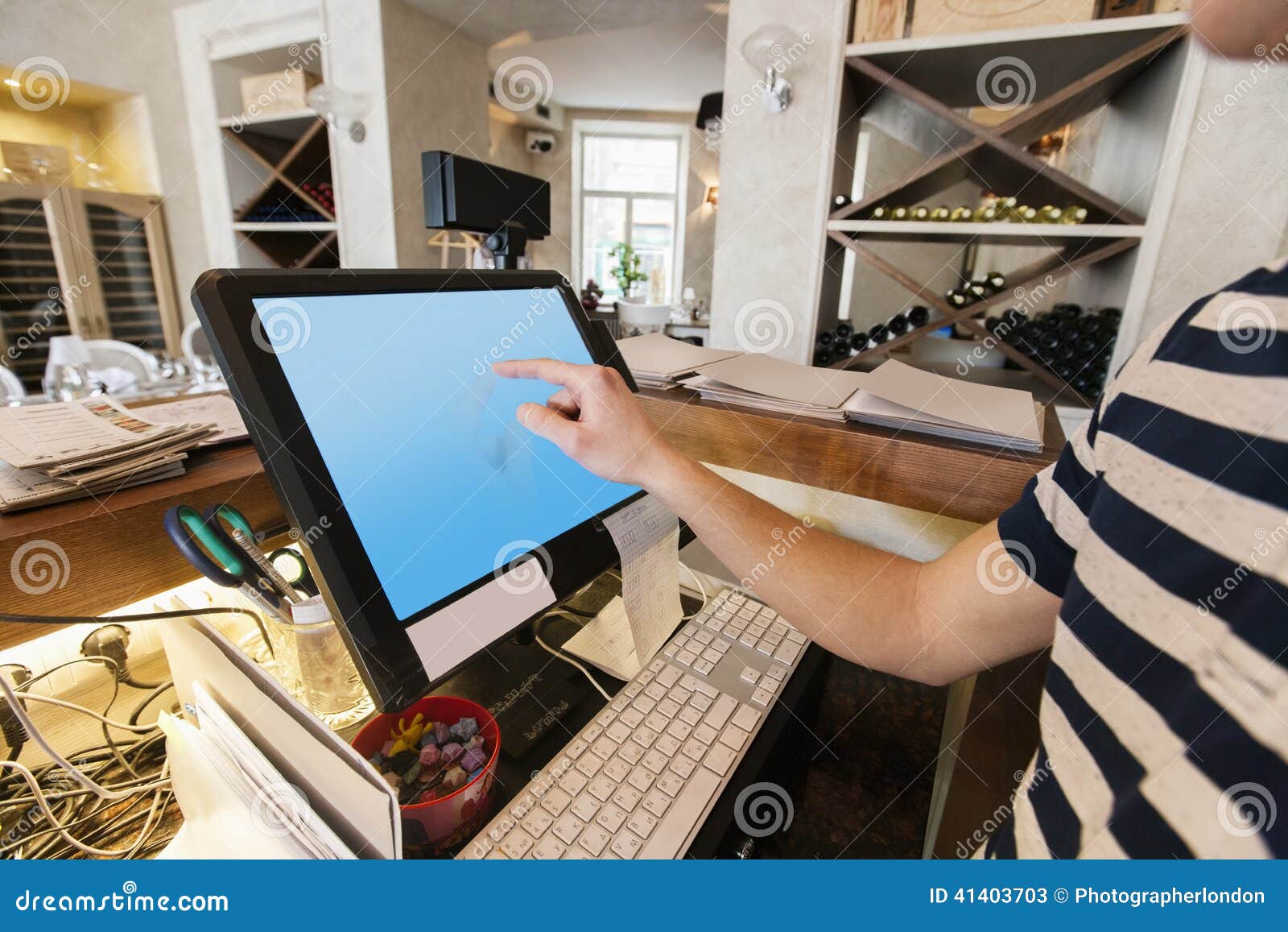 Cropped Image of Cashier Touching Computer Screen at Restaurant Counter ... Cropped Image of Cashier Touching Computer Screen at Restaurant Counter ...