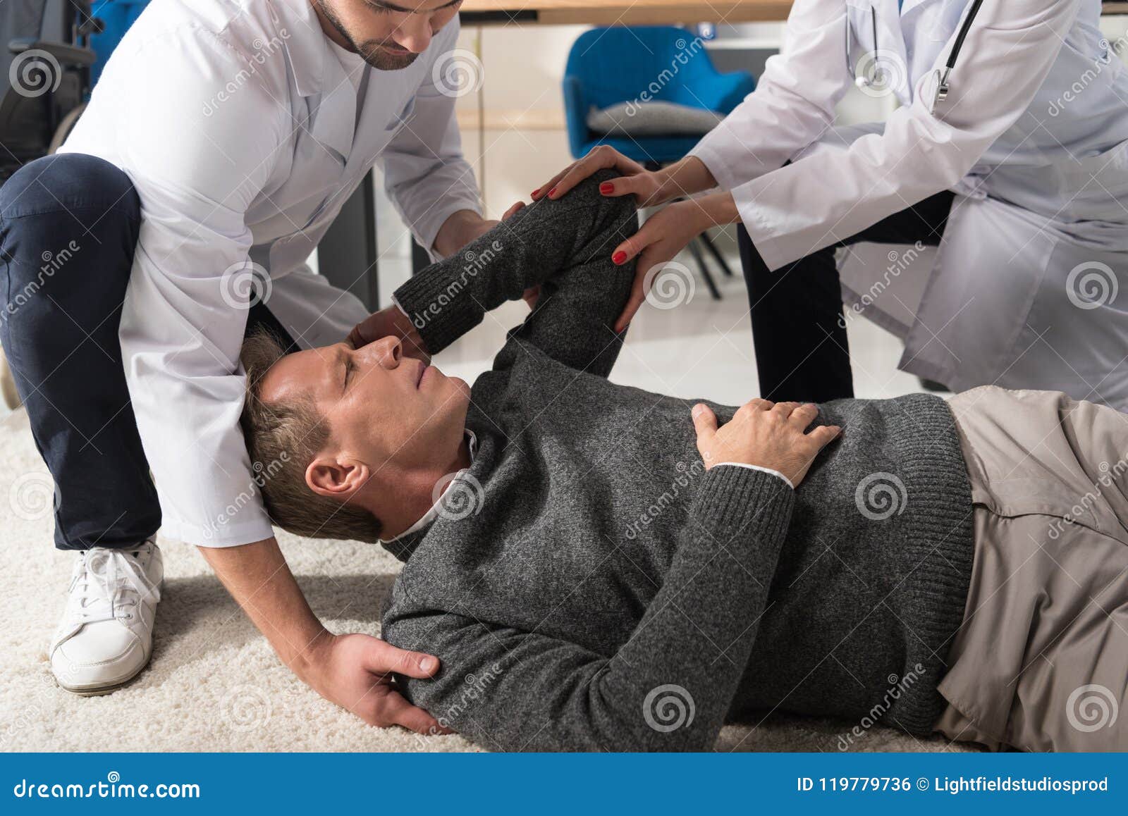 Cropped Image of Doctors Helping Stock Photo - Image of middle, aged ...