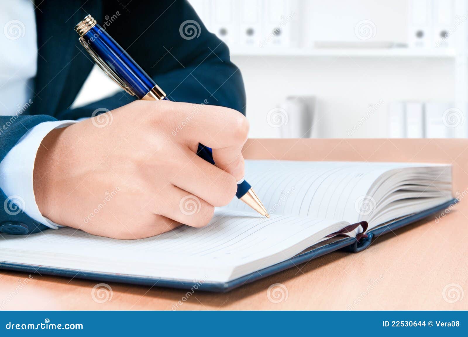 Cropped Image of Hand of Young Woman Taking Notes Stock Photo - Image ...