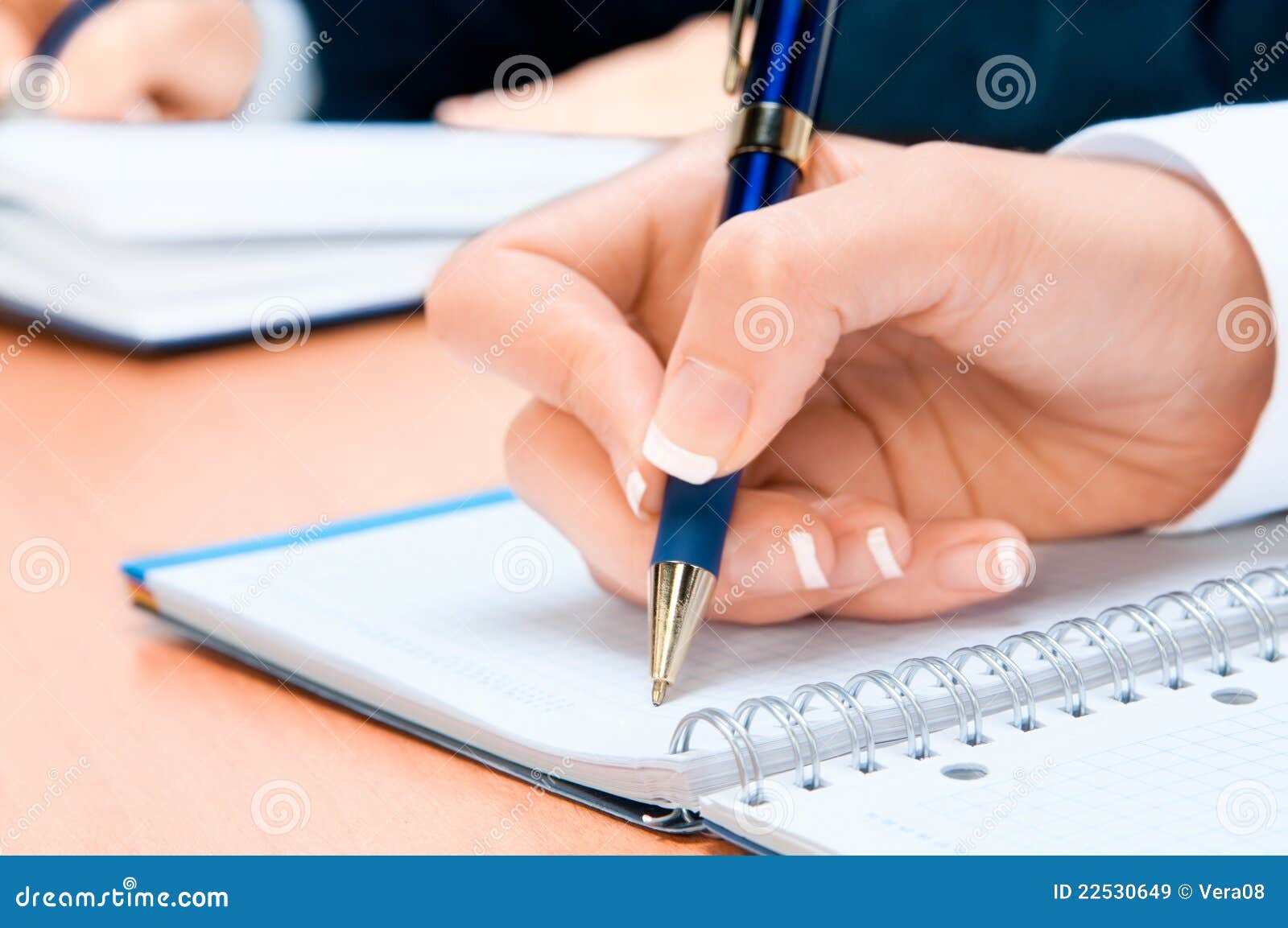 Cropped Image of Hand of Young Woman Taking Notes Stock Image - Image ...
