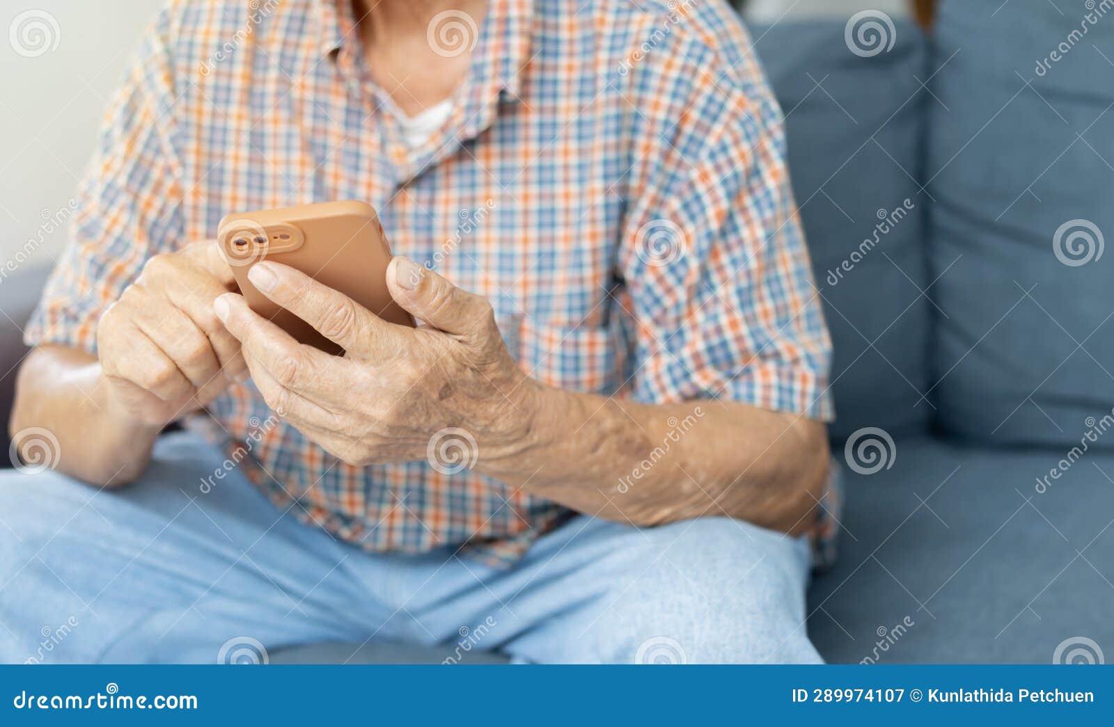Cropped Image of Hands of Older Man Holding a Smart Phone. Modern ...