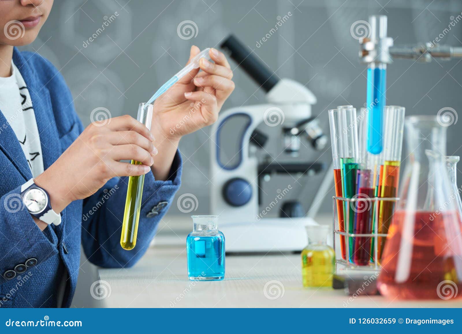 Boy working with reagents stock image. Image of classroom - 126032659