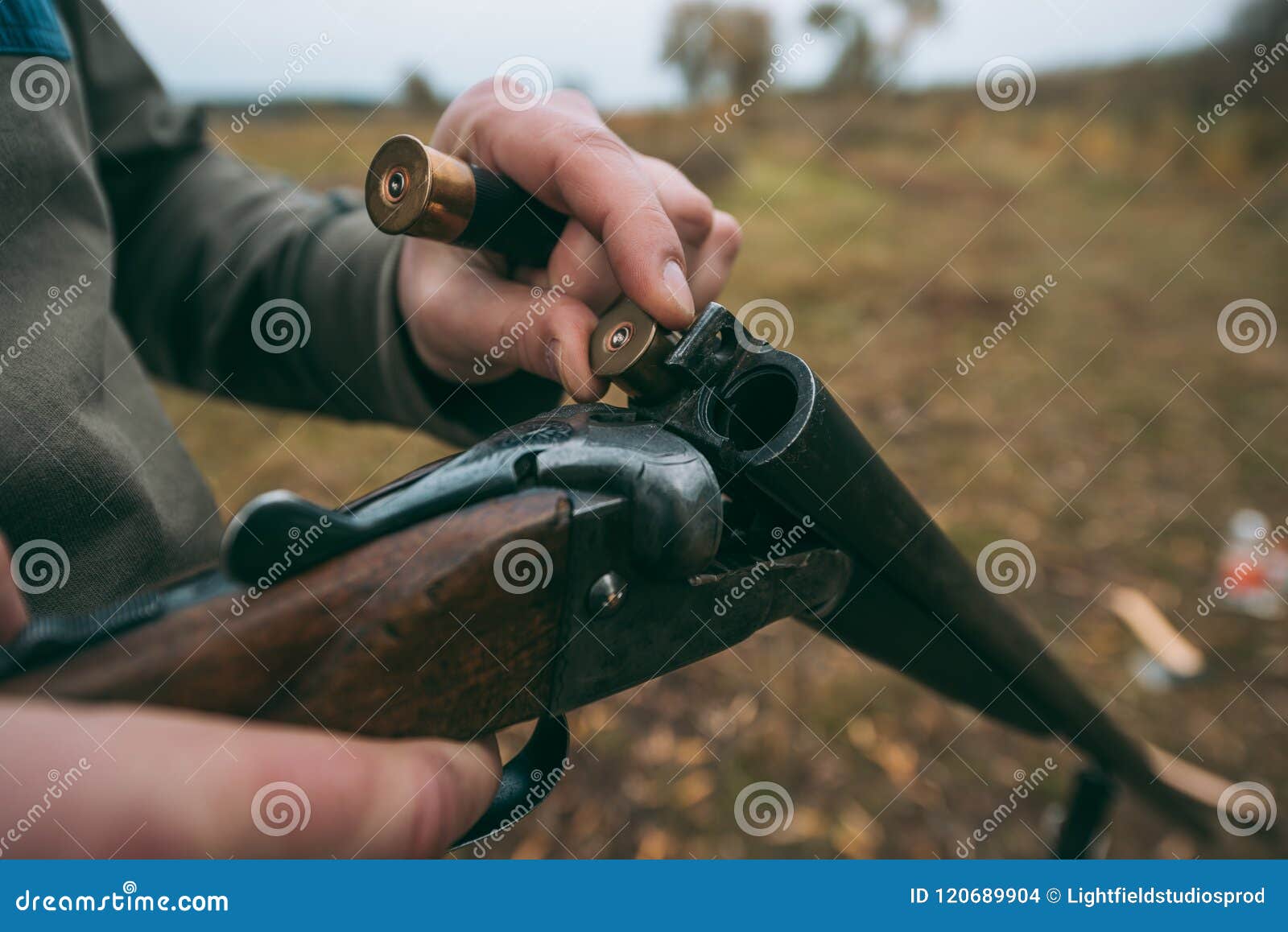 Cropped Image of Hunter Loading a Gun Stock Photo - Image of cropped ...