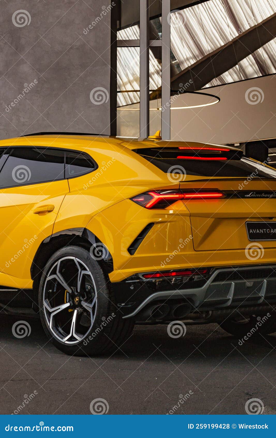 Cropped Image of a Lamborghini Urus SUV Yellow Rear 3-4 Vertical ...