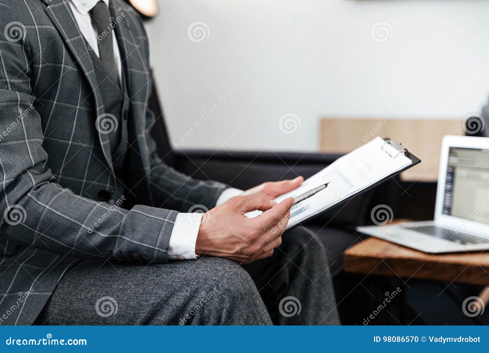 Cropped Image of a Man in Suit Analyzing Documents Stock Photo - Image ...