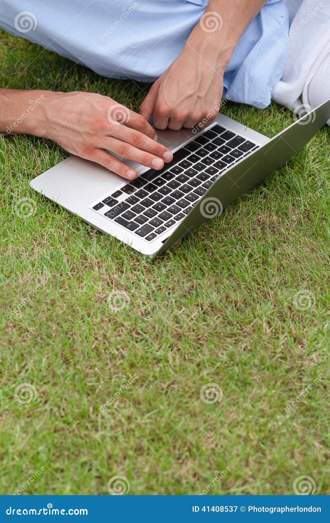 Cropped Image of Man Using Laptop on Grass in Park Stock Image - Image ...