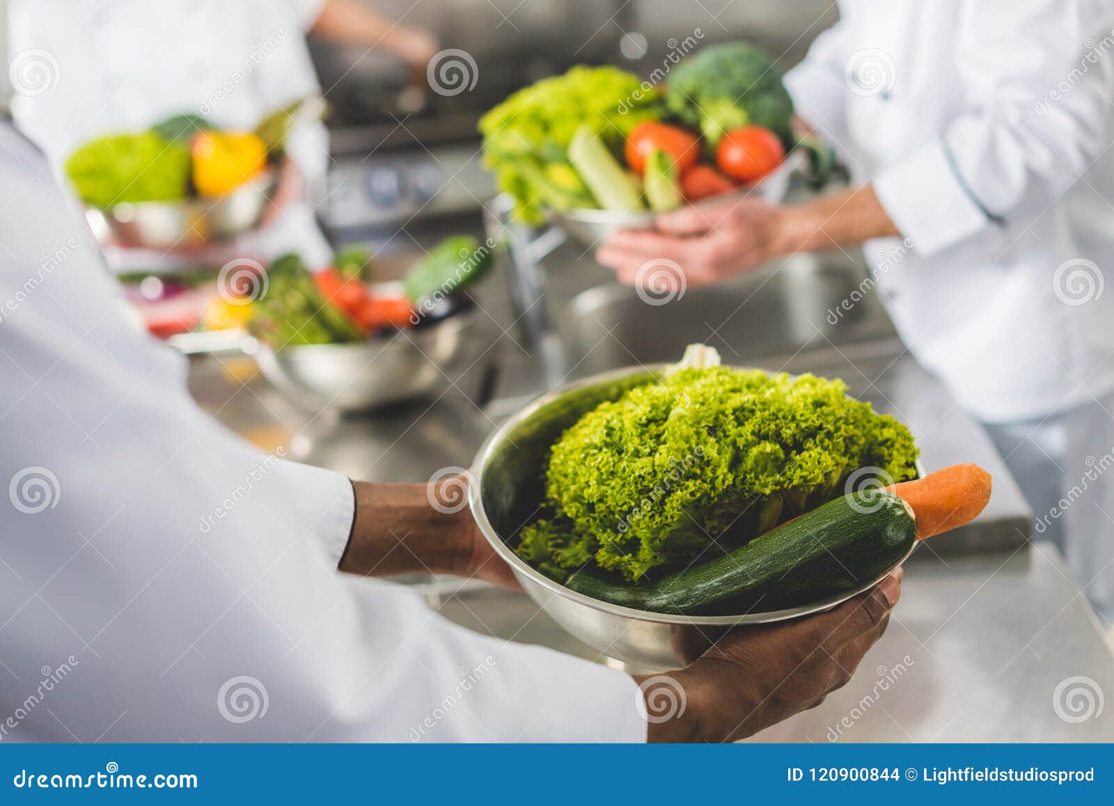 Cropped Image of Multicultural Chefs Holding Bowls with Vegetables ...