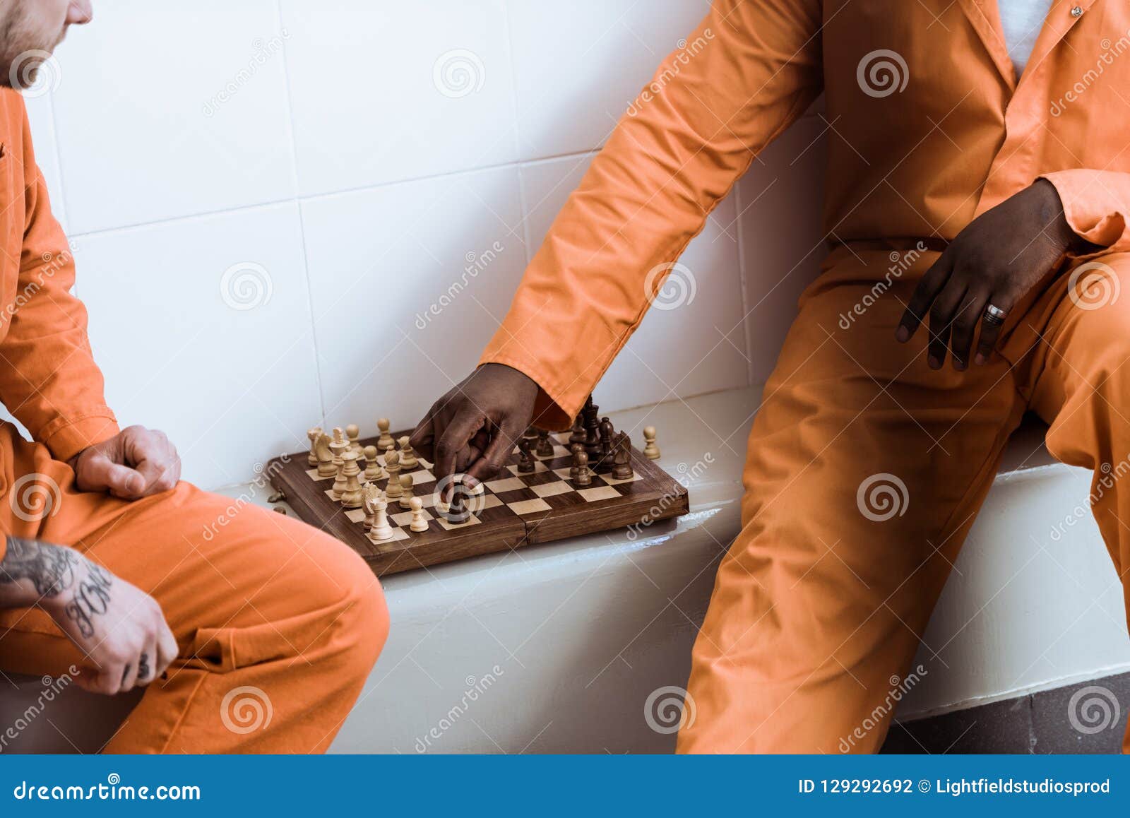 Cropped Image of Multicultural Prisoners Playing Chess Stock Photo ...