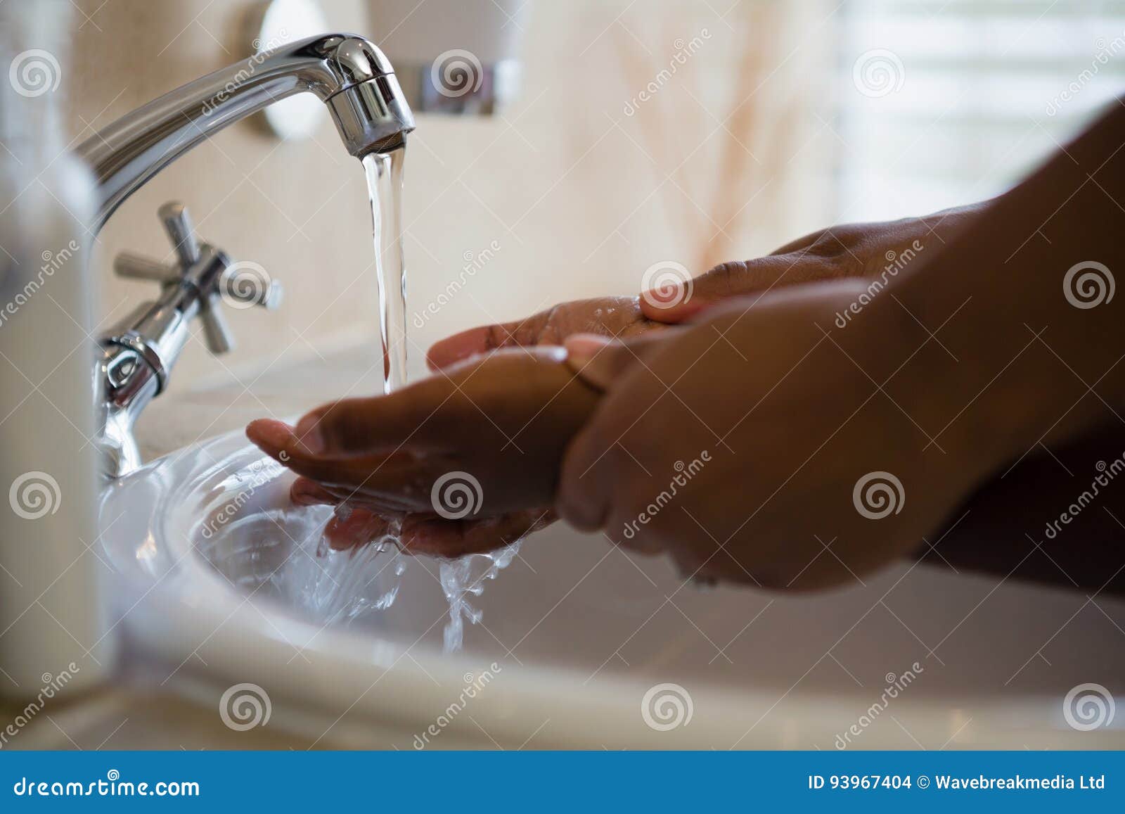 Cropped Image of People Washing Hands in Bathroom Sink Stock Photo ...
