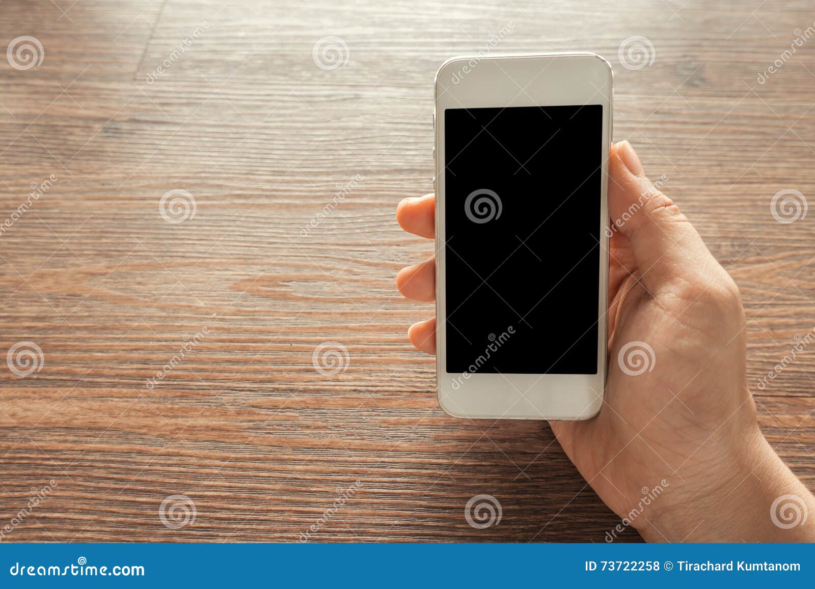 Cropped Image of Person Showing Mobile Phone at Desk Stock Photo ...