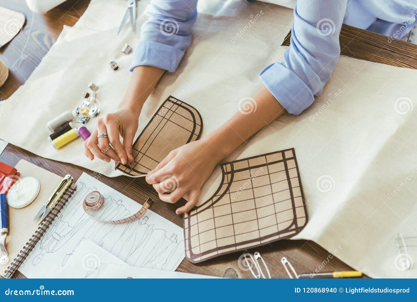 Cropped Image of Seamstress Putting Pin into Pattern Stock Photo ...
