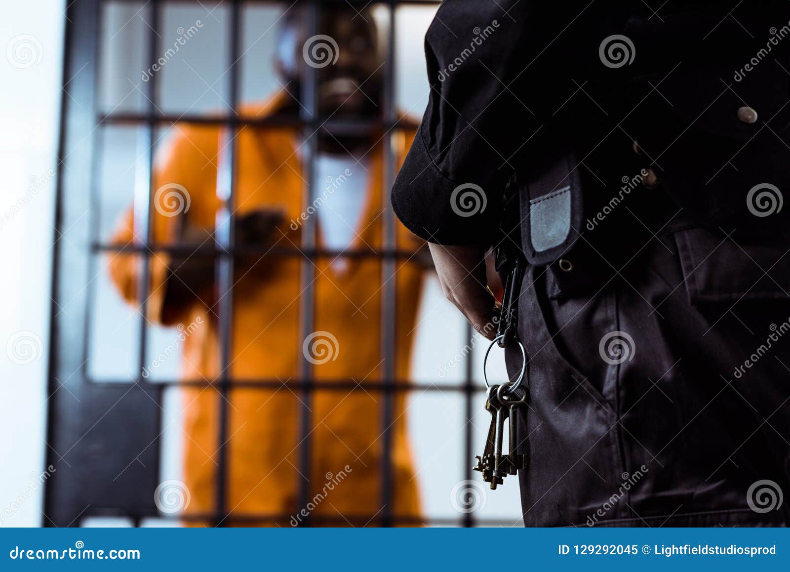 Cropped Image of Security Guard Standing Near Prison Bars Stock Image ...