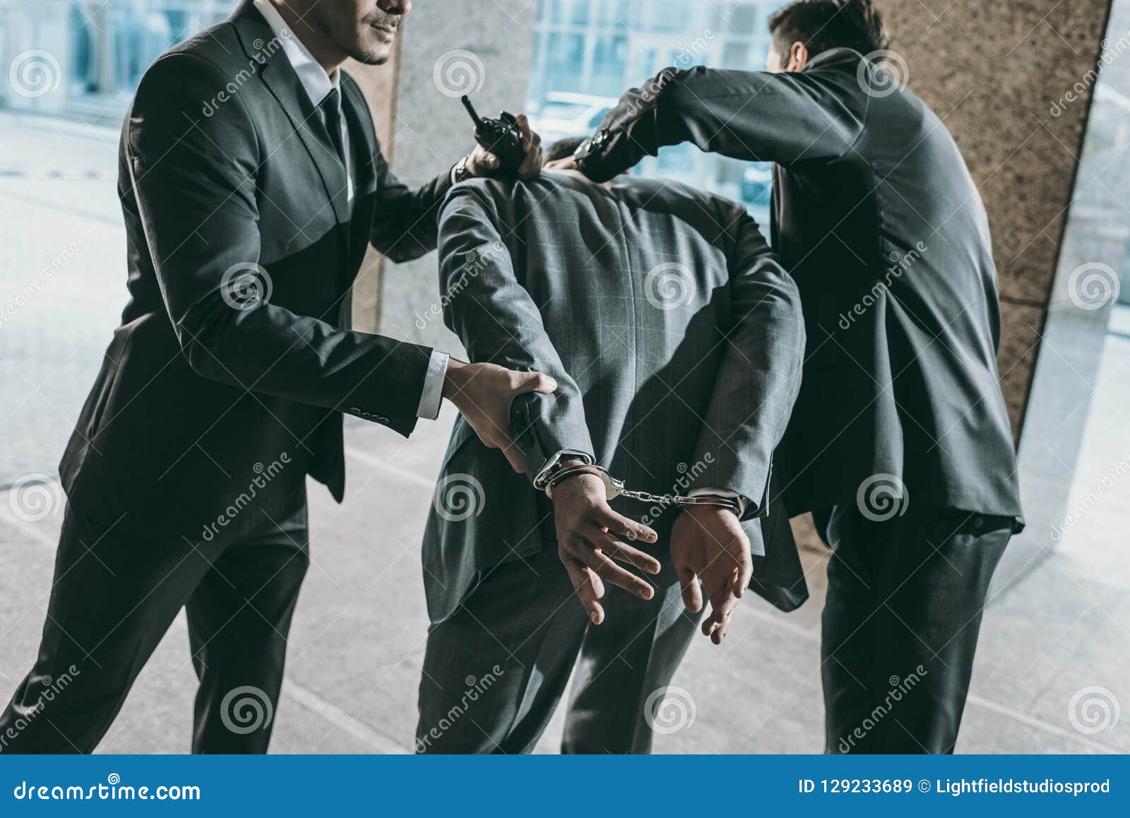 Cropped Image of Security Guards Arresting Stock Image - Image of ...