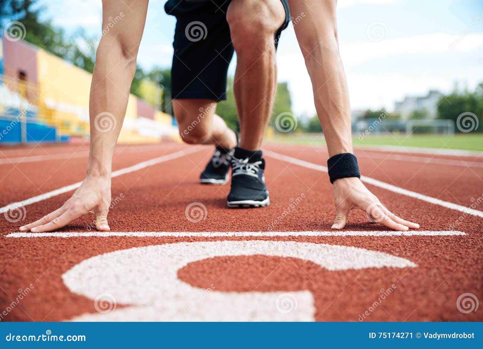 Cropped Image of a Sprinter Getting Ready To Start Stock Image - Image ...