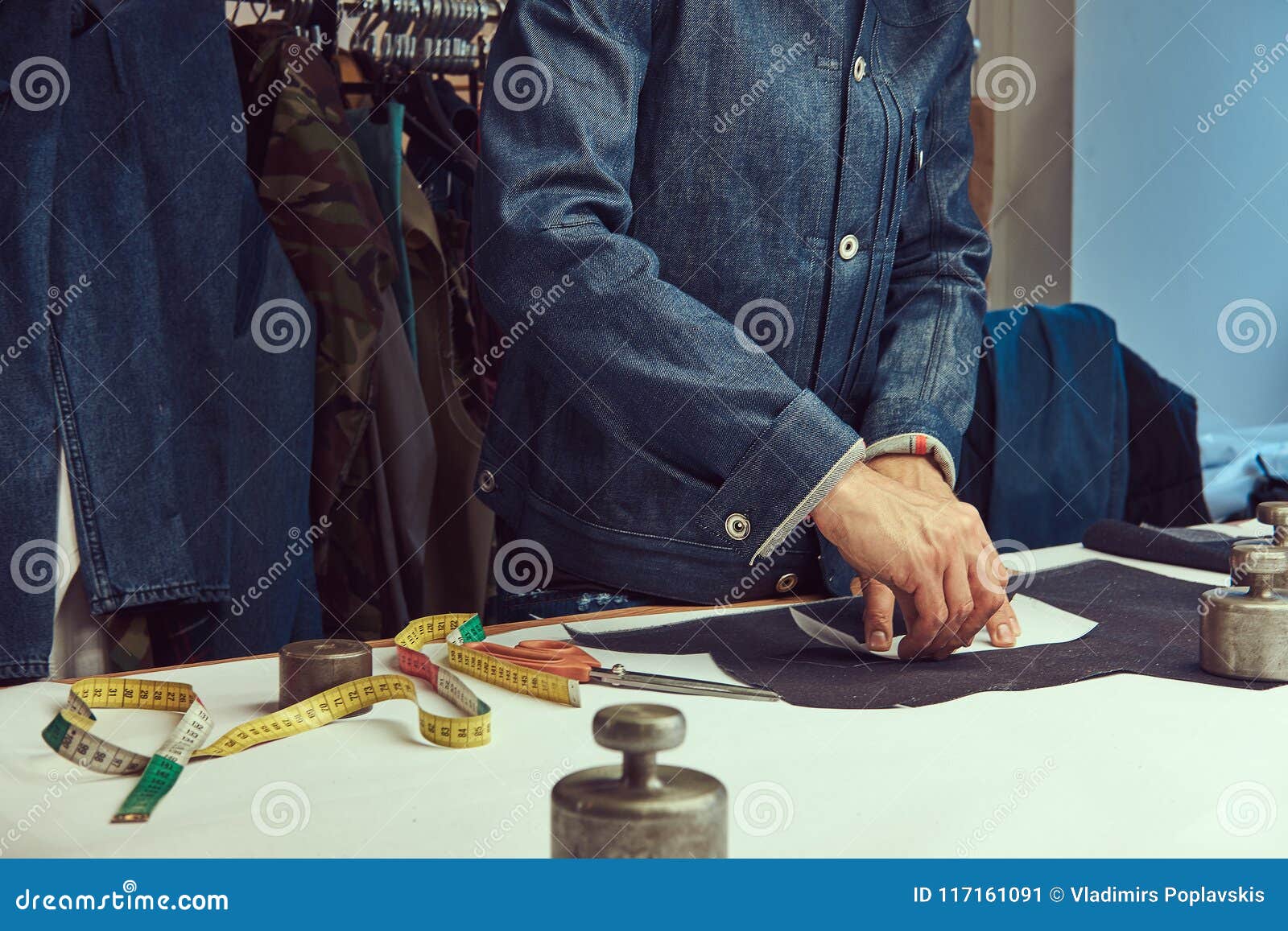 Cropped Image of a Tailor Working with Cloth Samples at Sewing Workshop ...