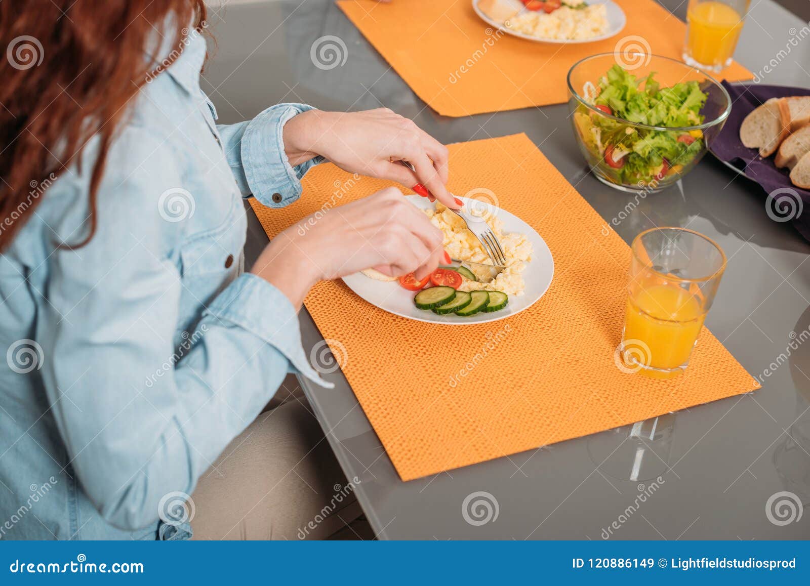 Cropped Image of Woman Eating at Table Stock Image - Image of food ...