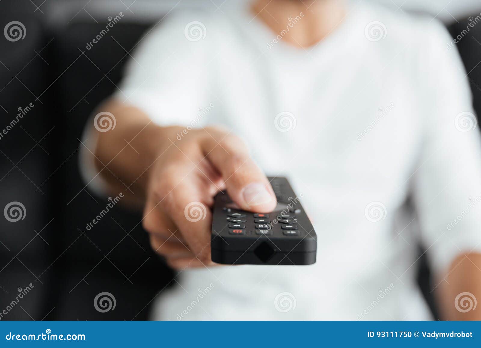 Cropped Image of Young Man Holding Remote Control. Stock Photo - Image ...
