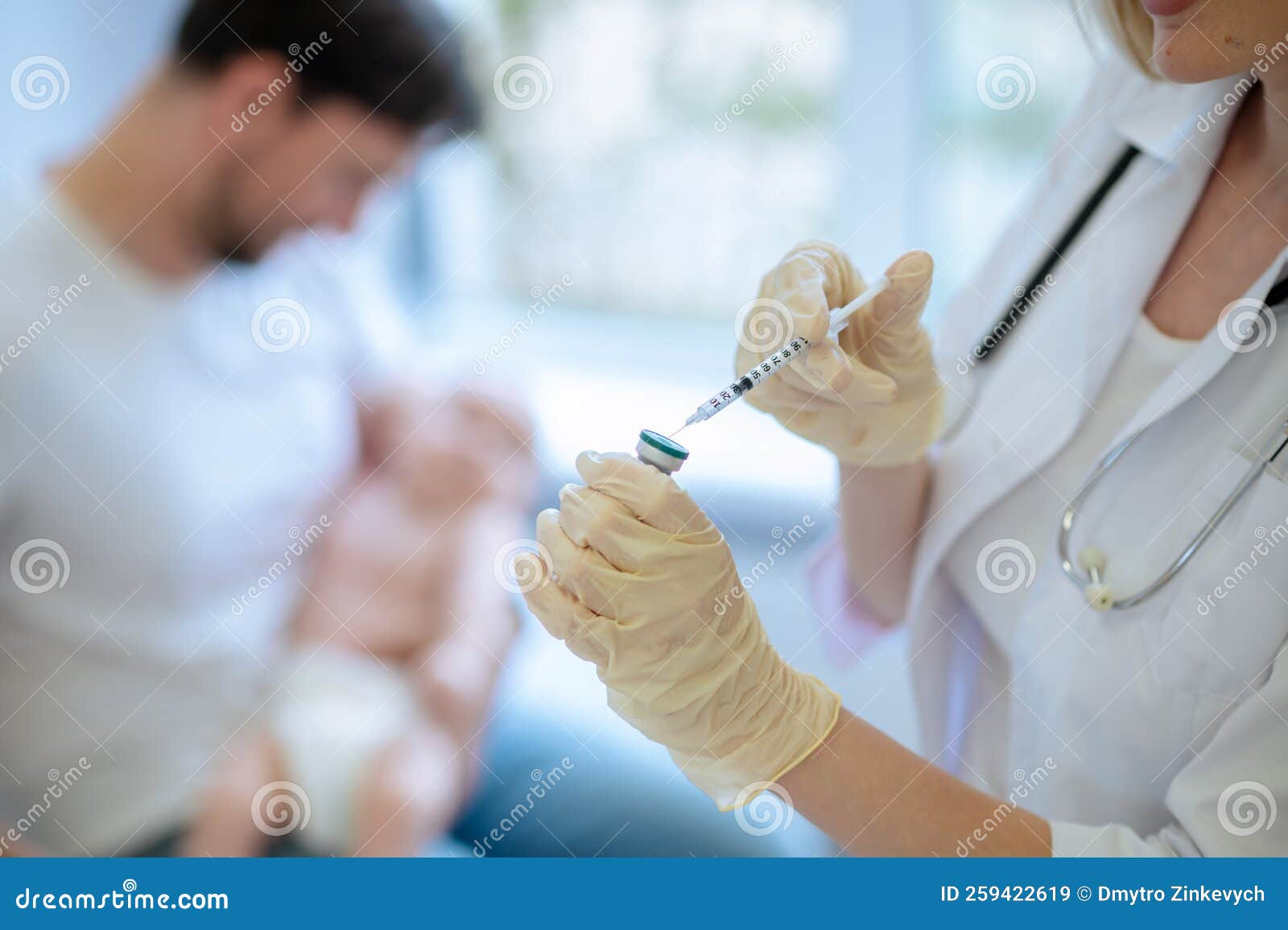 Doctor Preparing To Administer An Injection To A Patient Stock Image
