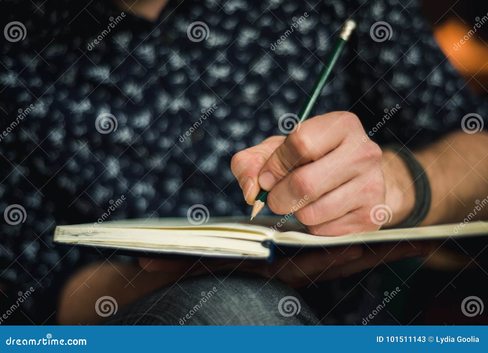 Man Writing in Journal with a Pencil Stock Image - Image of action ...