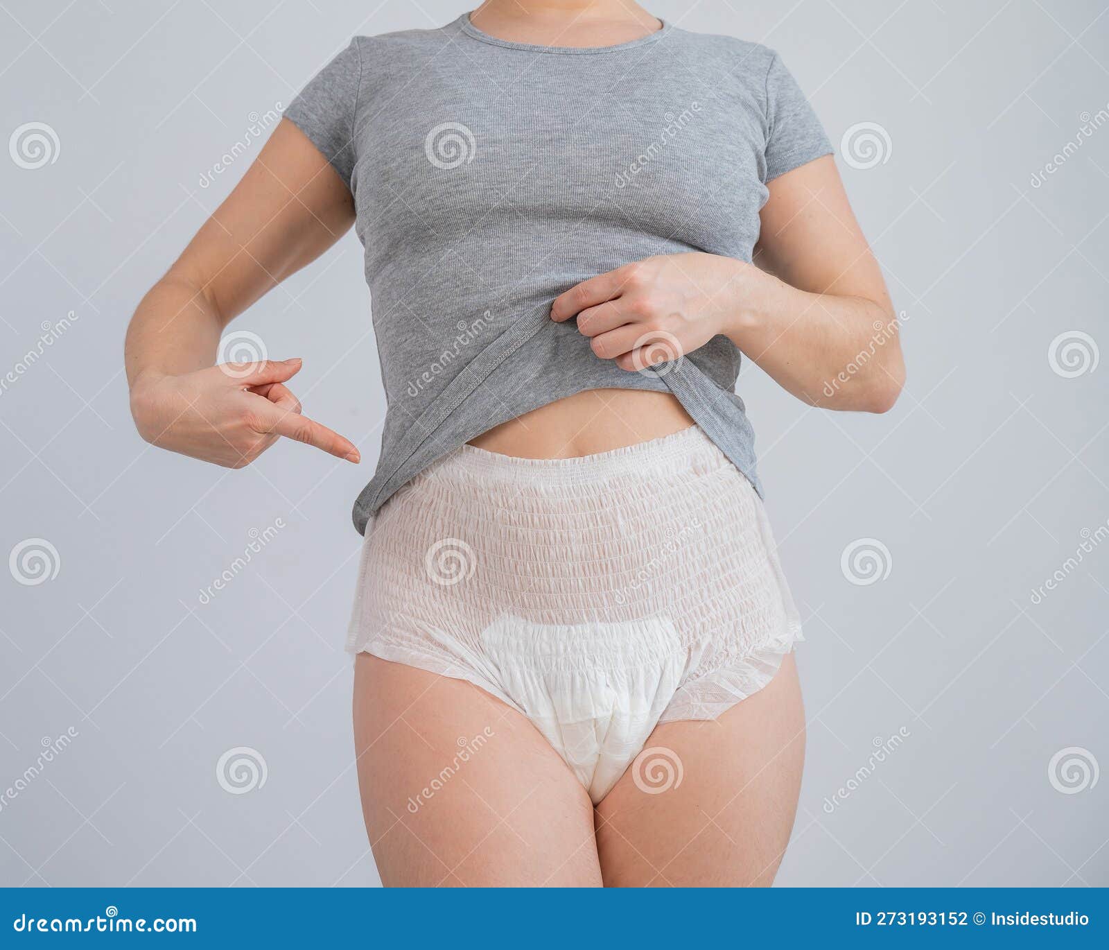A Cropped Portrait of a Woman Pointing at Adult Diapers on Her. Urinary ... A Cropped Portrait of a Woman Pointing at Adult Diapers on Her. Urinary ...