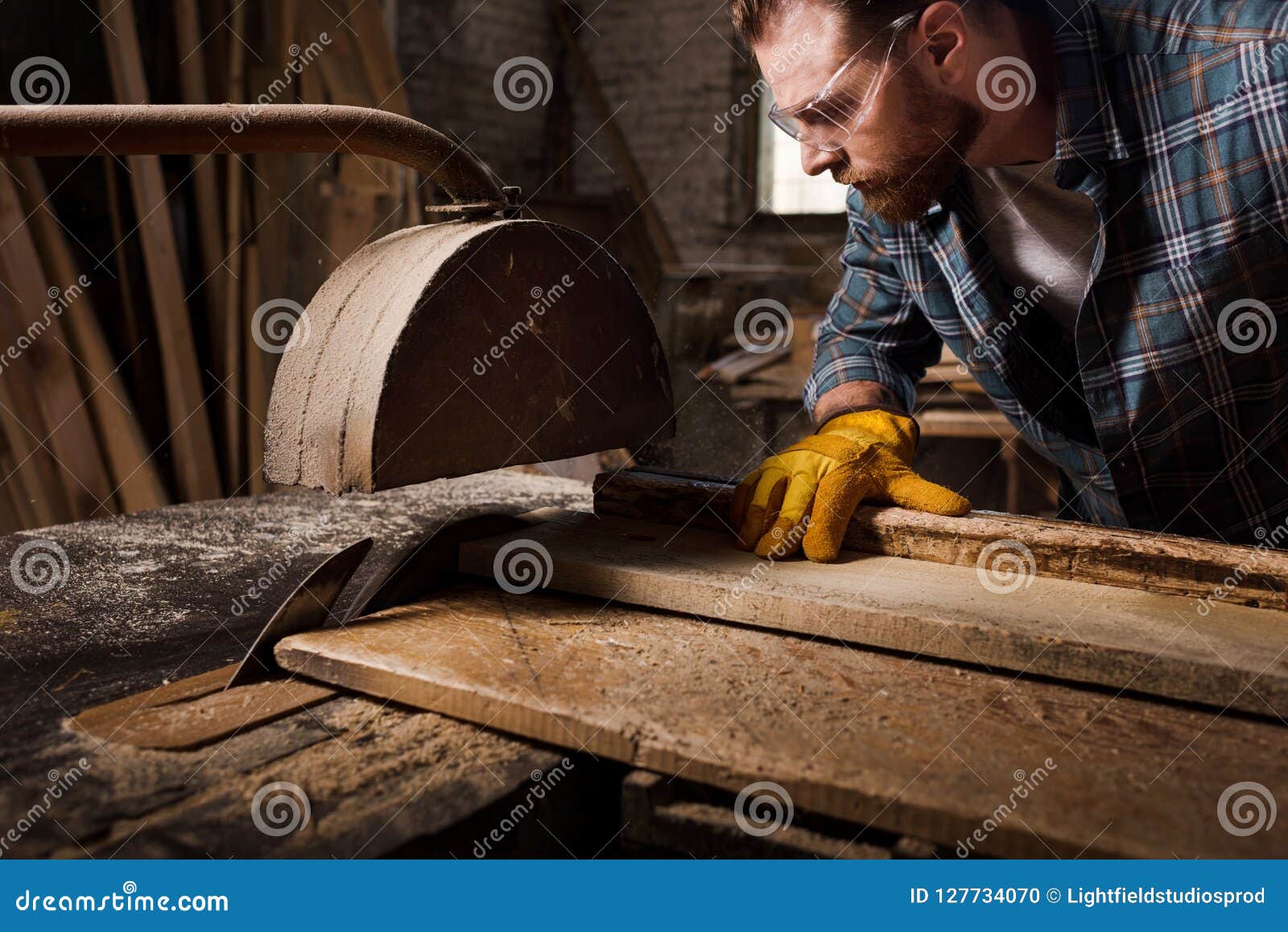 Cropped Shot of Bearded Carpenter in Protective Gloves and Googles ...