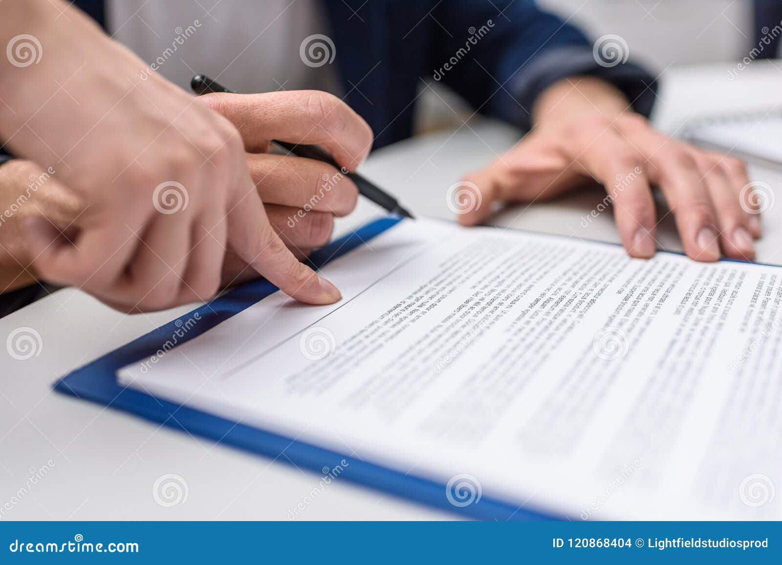 Cropped Shot of Client Signing Contract while Manageress Pointing Stock ... Cropped Shot of Client Signing Contract while Manageress Pointing Stock ...