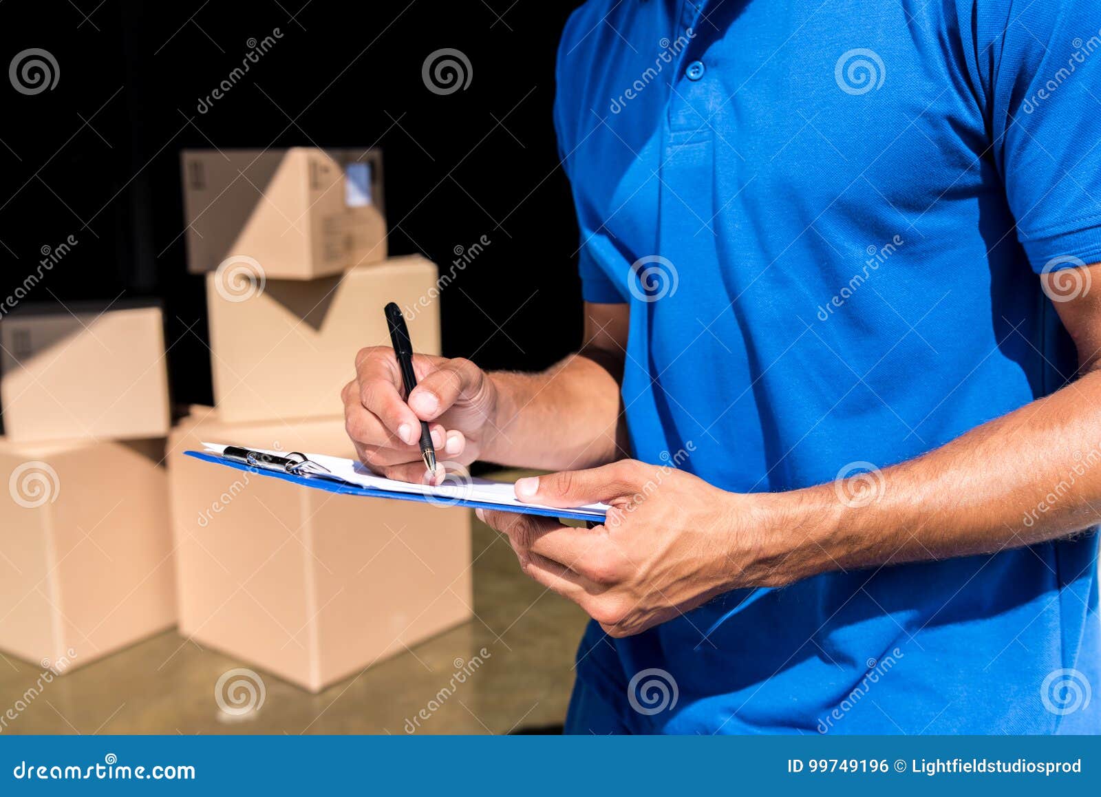 Delivery Man with Documents Stock Photo - Image of hands, post: 99749196