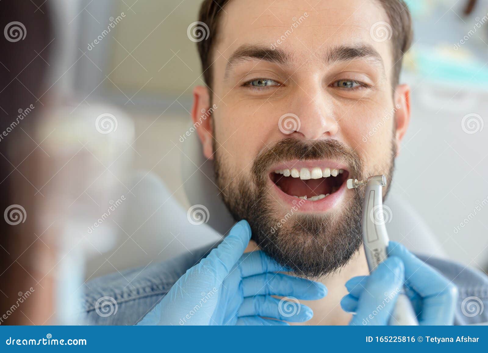 Cropped Shot of Dentist Examining Teeth of Male Client Stock Photo ...