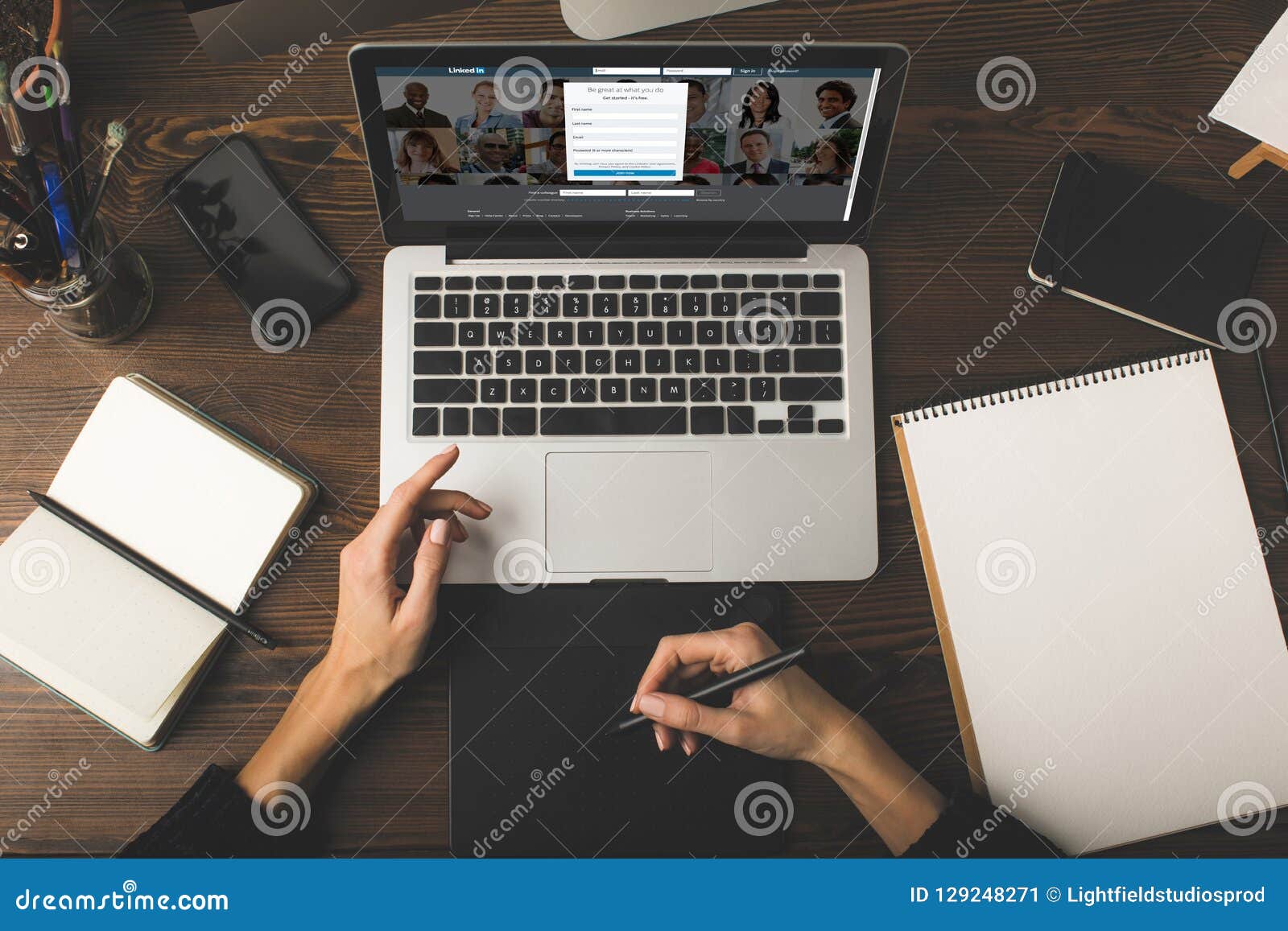 Cropped Shot of Designer Using Graphics Tablet and Laptop with Linkedin ...