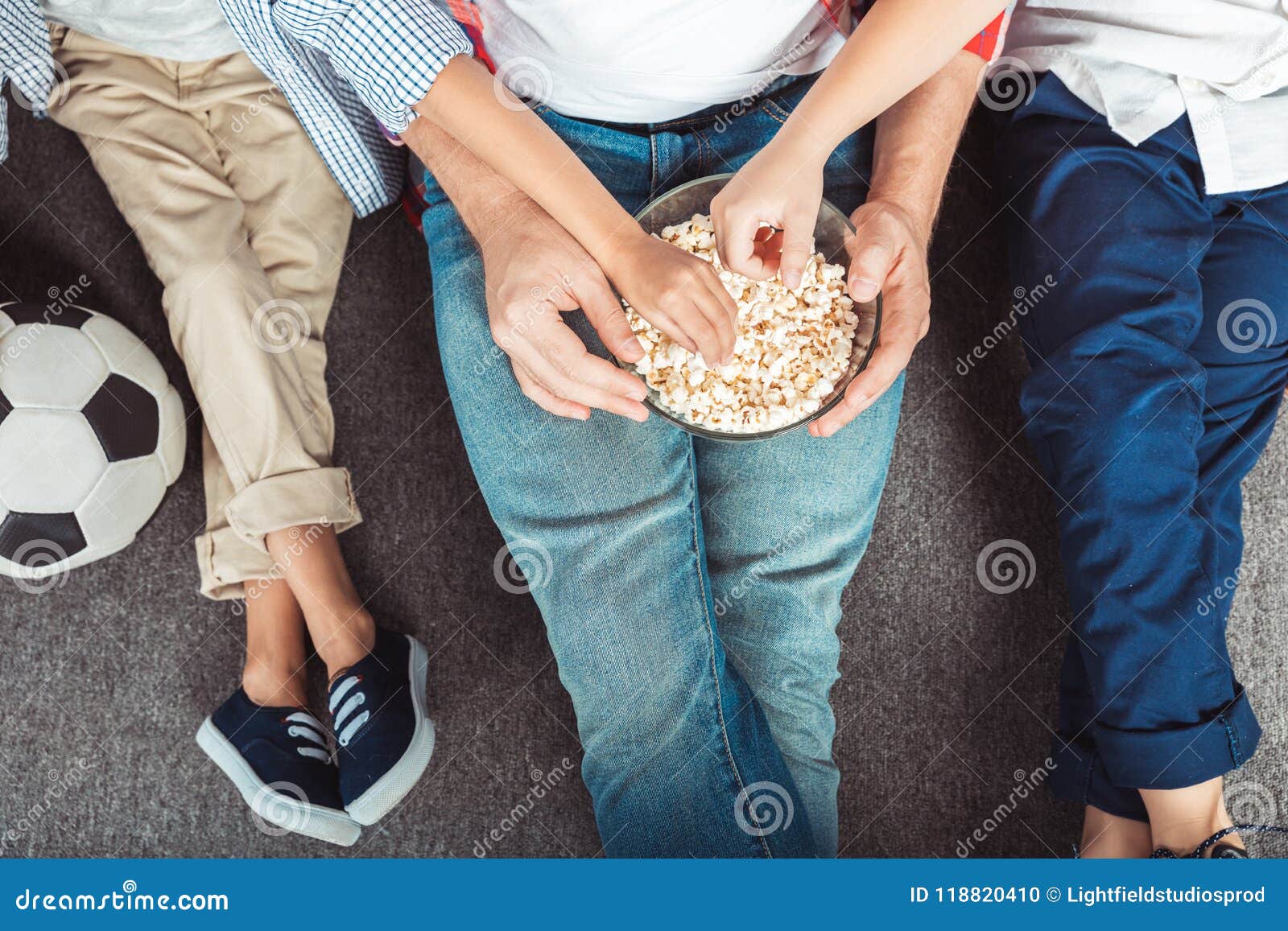 Cropped Shot of Father with Sons Eating Popcorn Stock Photo - Image of ...