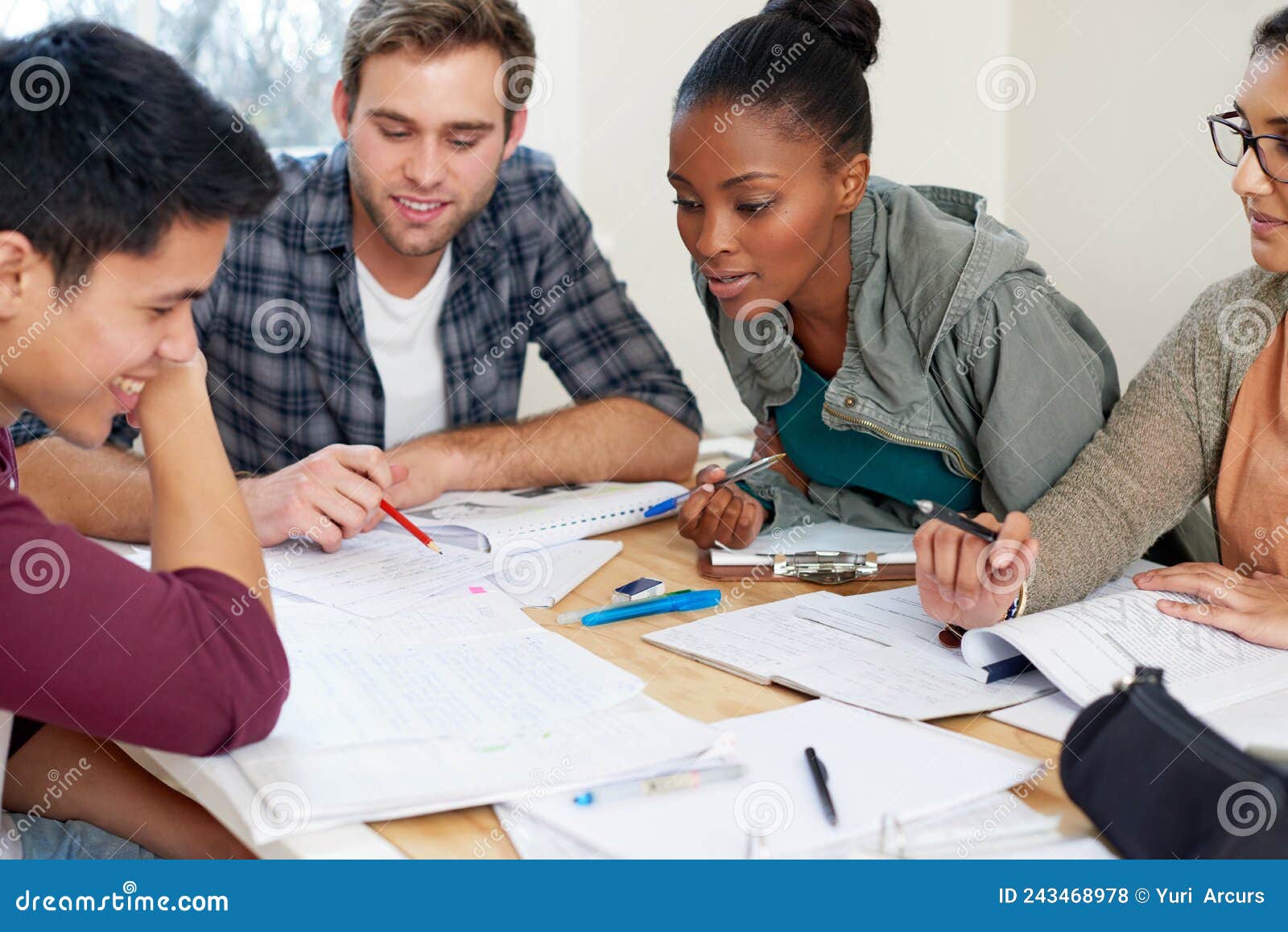 Theyre Helping Him Study. Cropped Shot of a Group of University ...