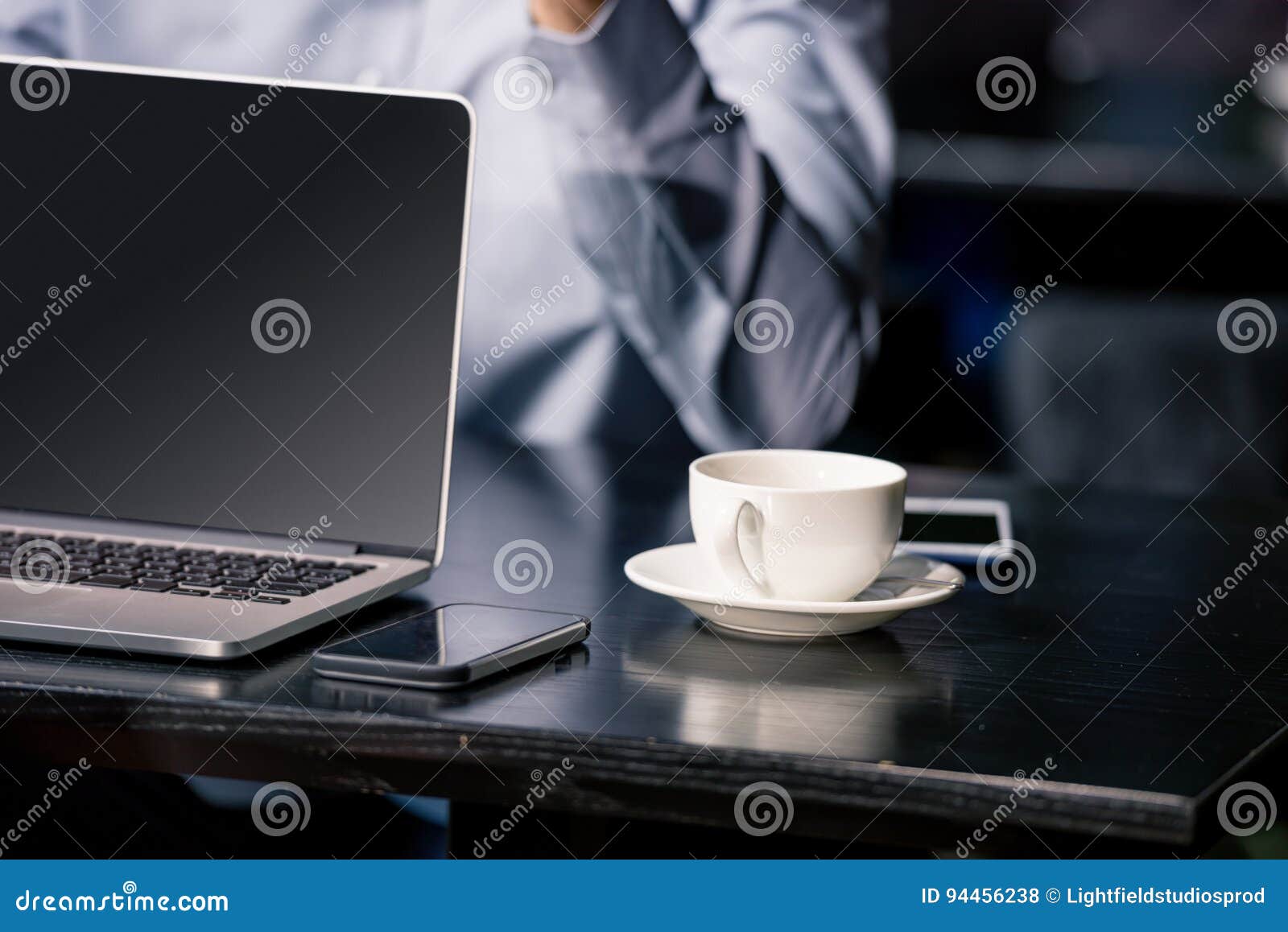 Cropped Shot of Laptop Computer, Smartphone and Cup of Coffee in Cafe ...