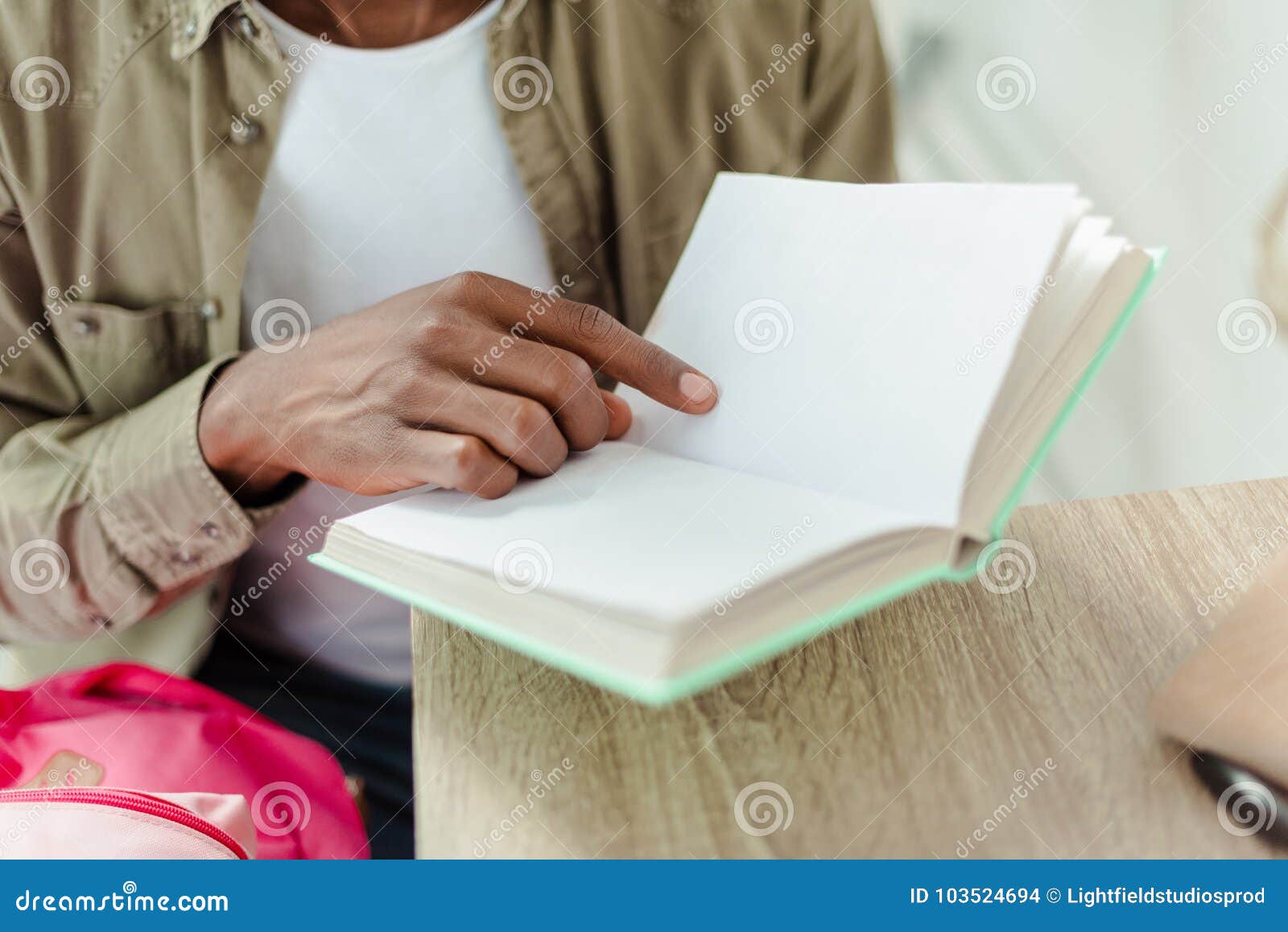 Man Pointing at Open Book Page Stock Photo - Image of hand, desk: 103524694