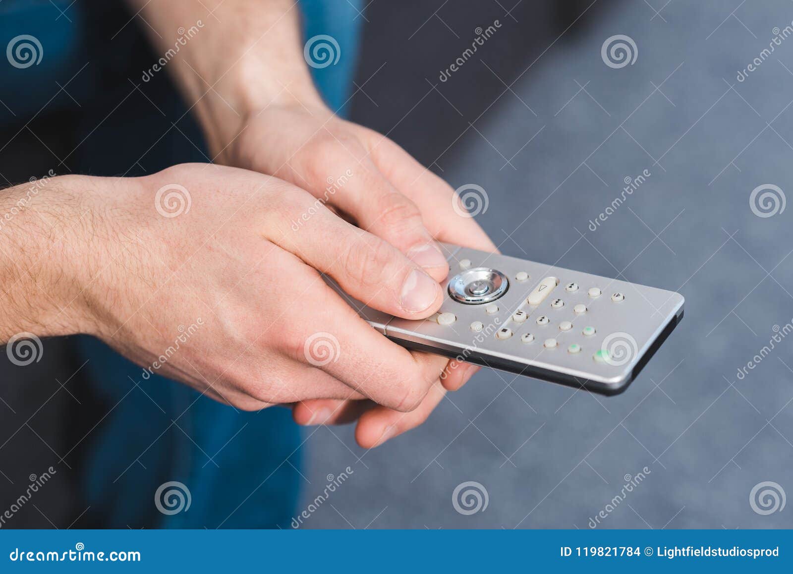 Cropped Shot of Man Using Remote Controller Stock Photo - Image of ...