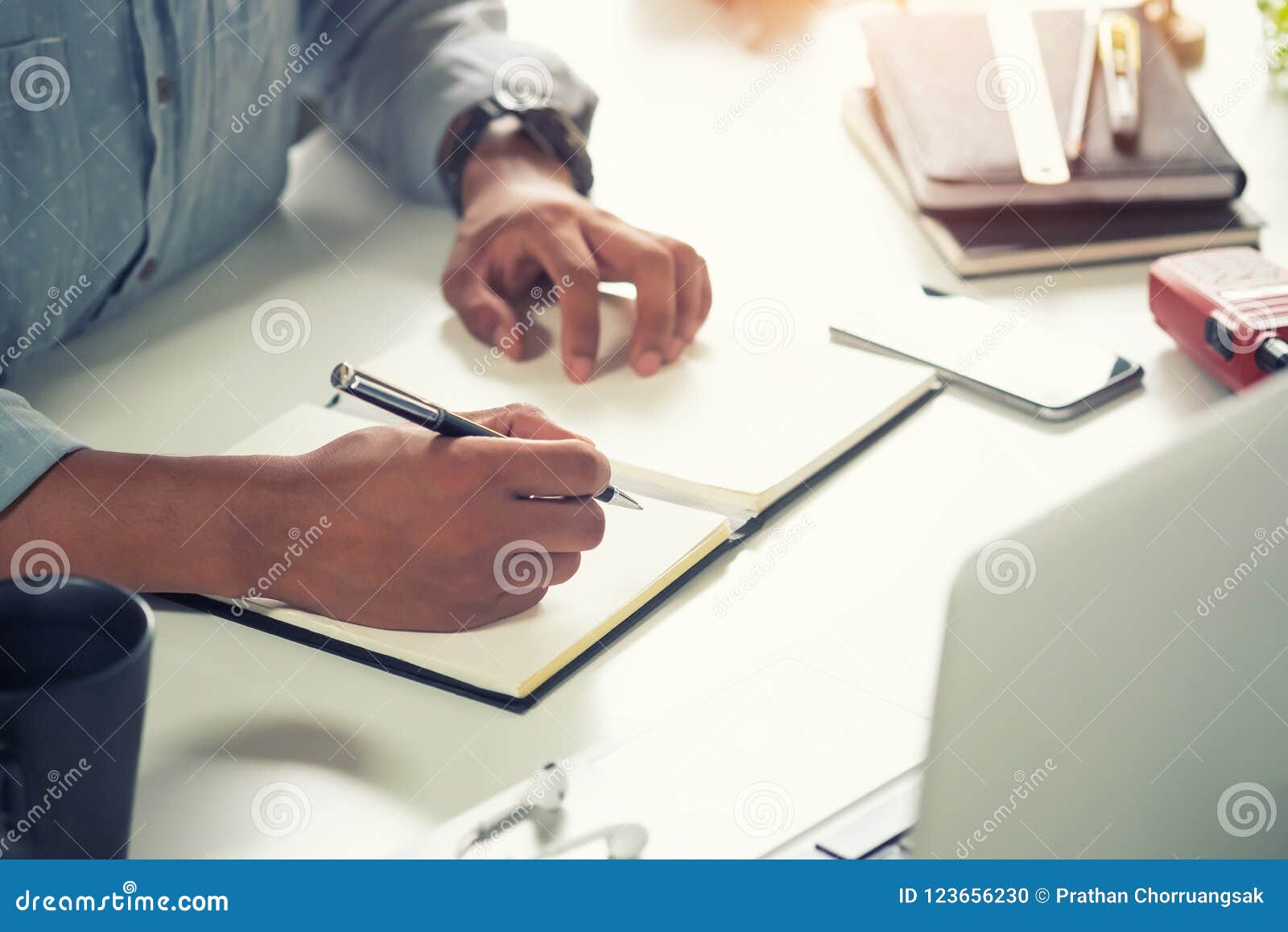 Cropped Shot a Man Writing on Notebook Paper on Workplace. Stock Photo ...
