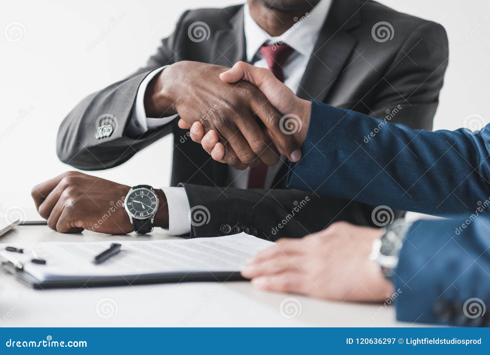 Cropped Shot of Multicultural Businessmen Shaking Hands during Contract ... Cropped Shot of Multicultural Businessmen Shaking Hands during Contract ...
