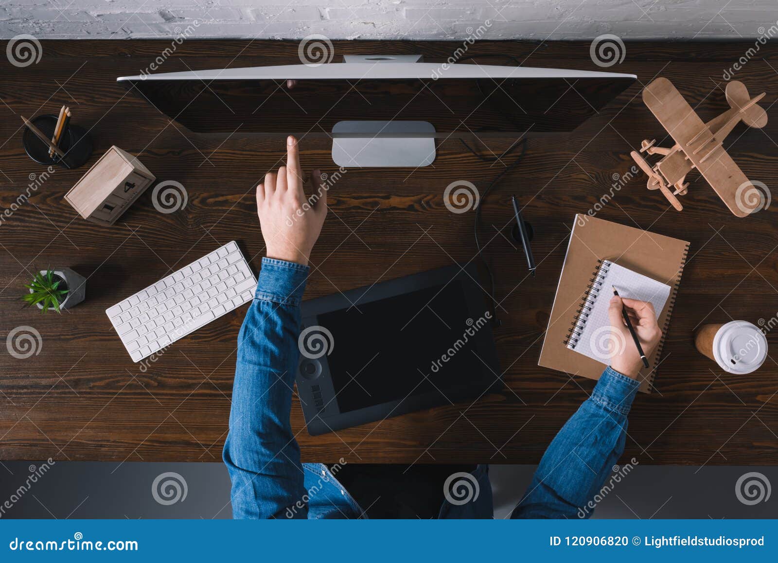 Cropped Shot of Person Using Desktop Computer and Taking Notes Stock ...