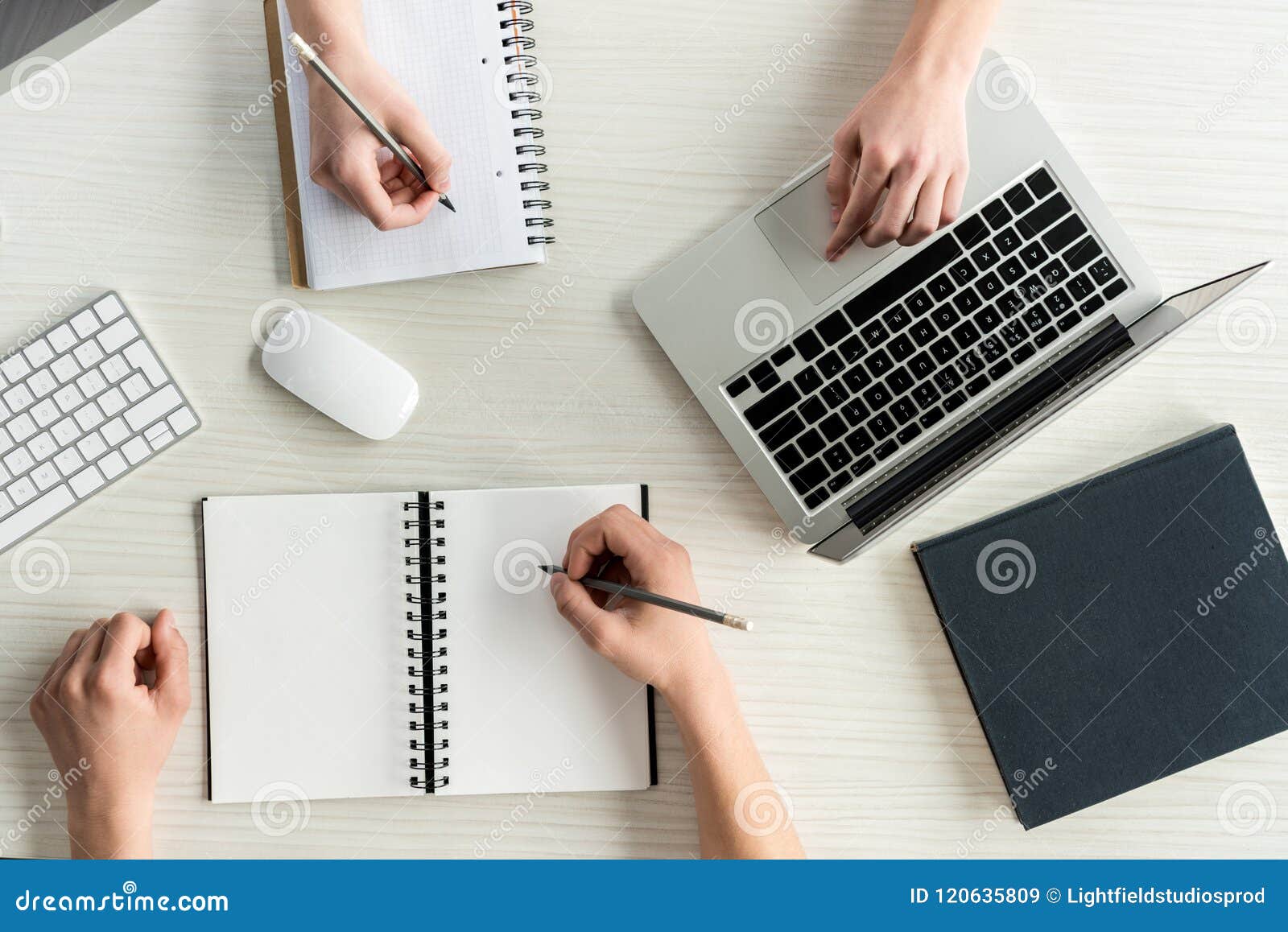 Cropped Shot of Students Using Digital Devices while Doing Stock Image ...
