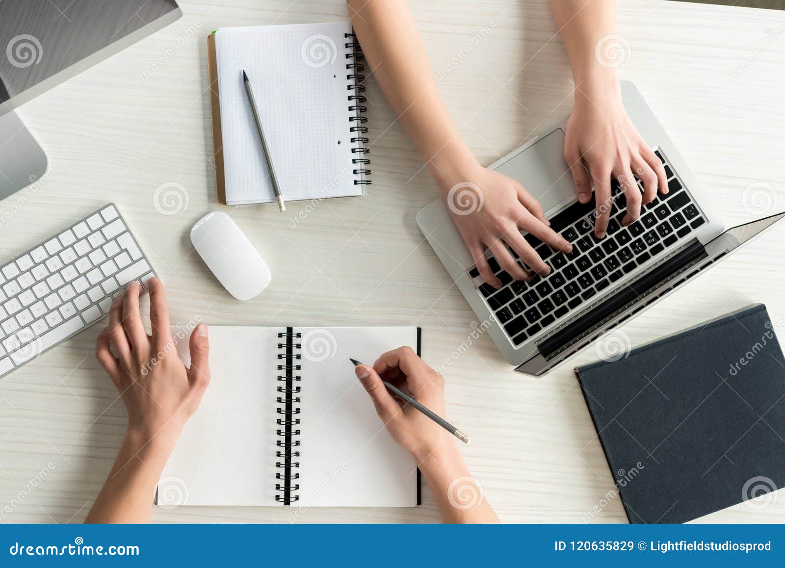 Cropped Shot of Students Using Digital Devices while Doing Stock Image ...