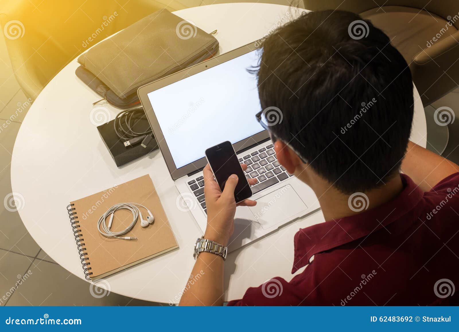 Cropped Shot of a Young Man Working from Home Using Smart Phone Stock ...