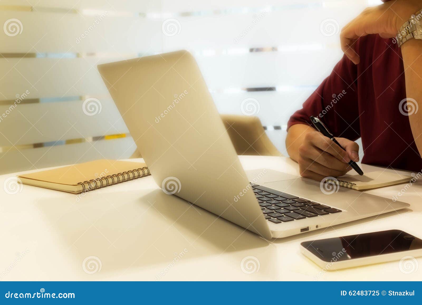 Cropped Shot of a Young Man Writing Note with Laptop Computer, M Stock ...