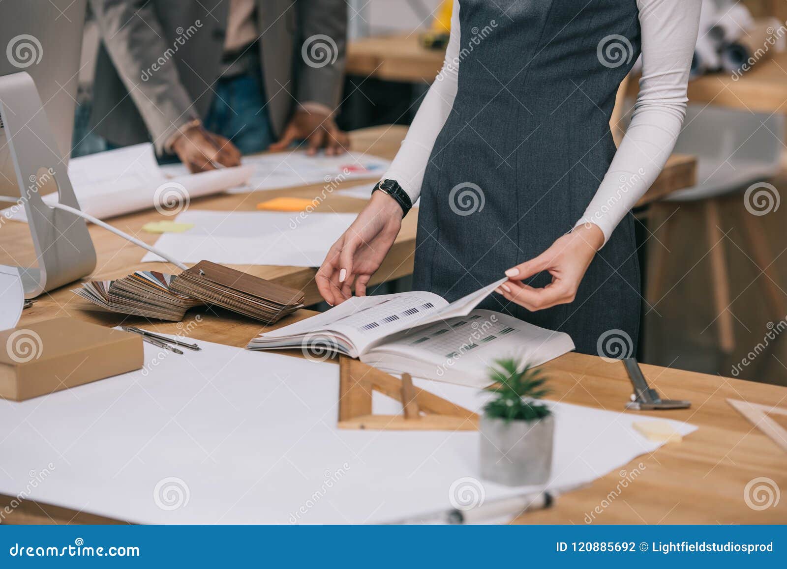 Cropped View of Architect Reading Book at Workplace Stock Photo - Image ...