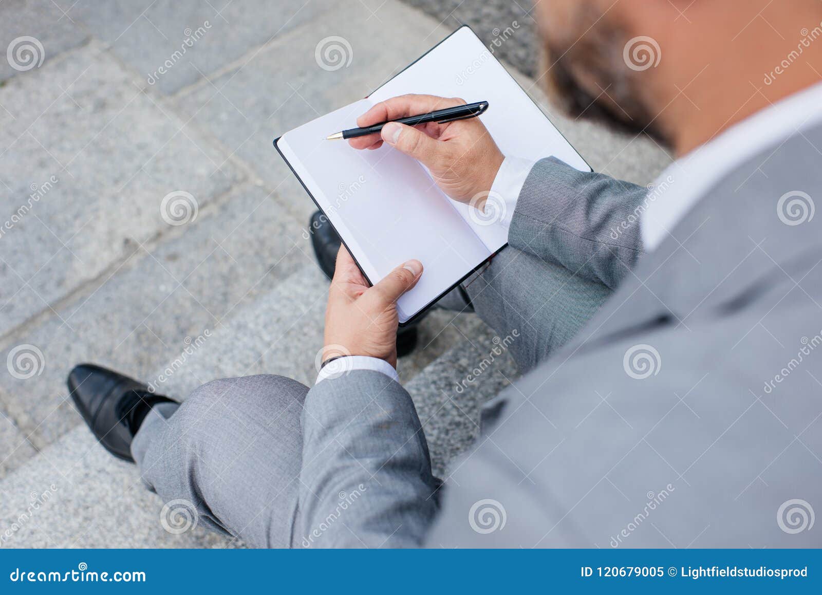 Cropped View of Businessman in Grey Jacket Writing Stock Image - Image ...