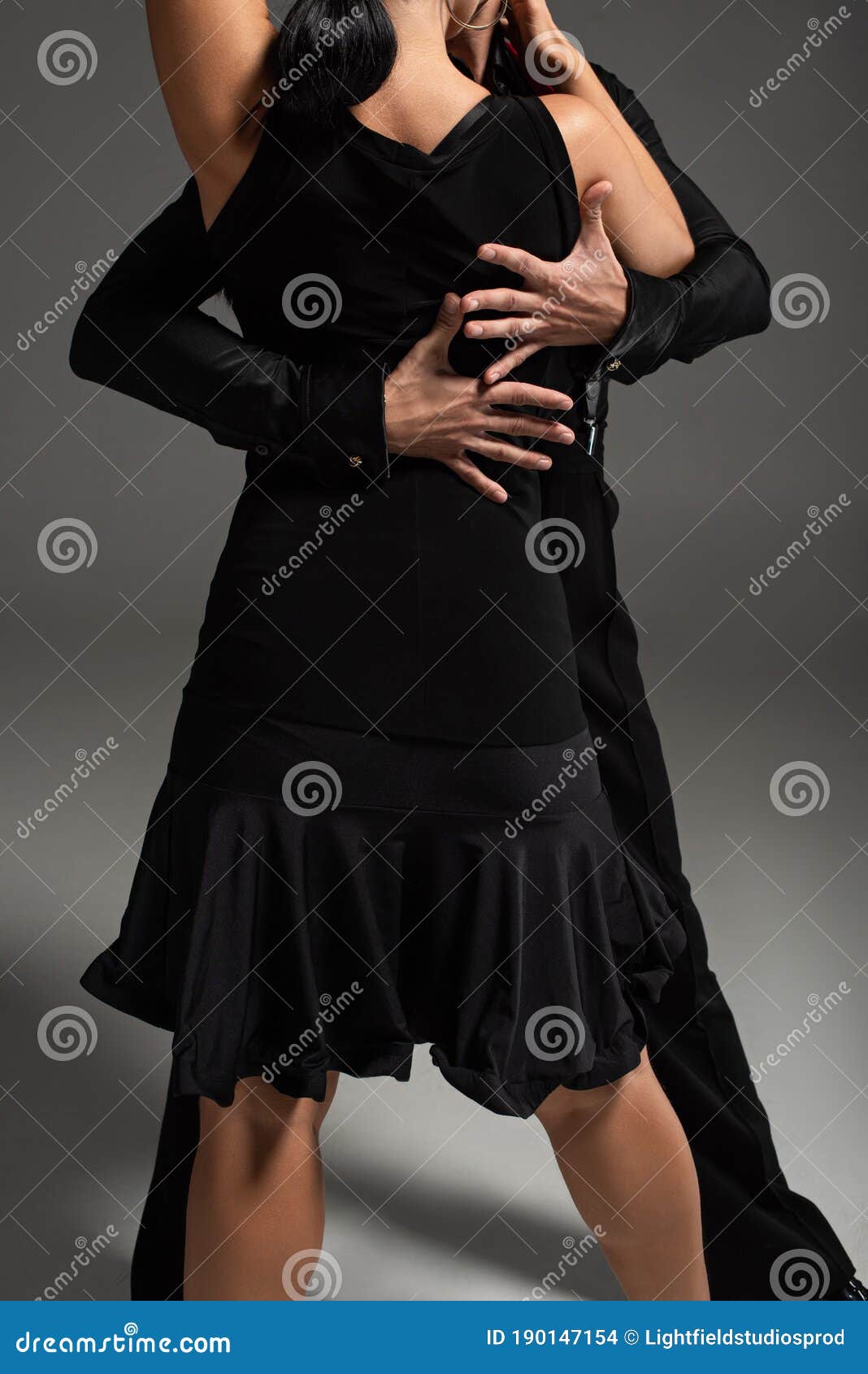 View of Dancer Hugging Partner while Dancing Tango on Grey Background ...