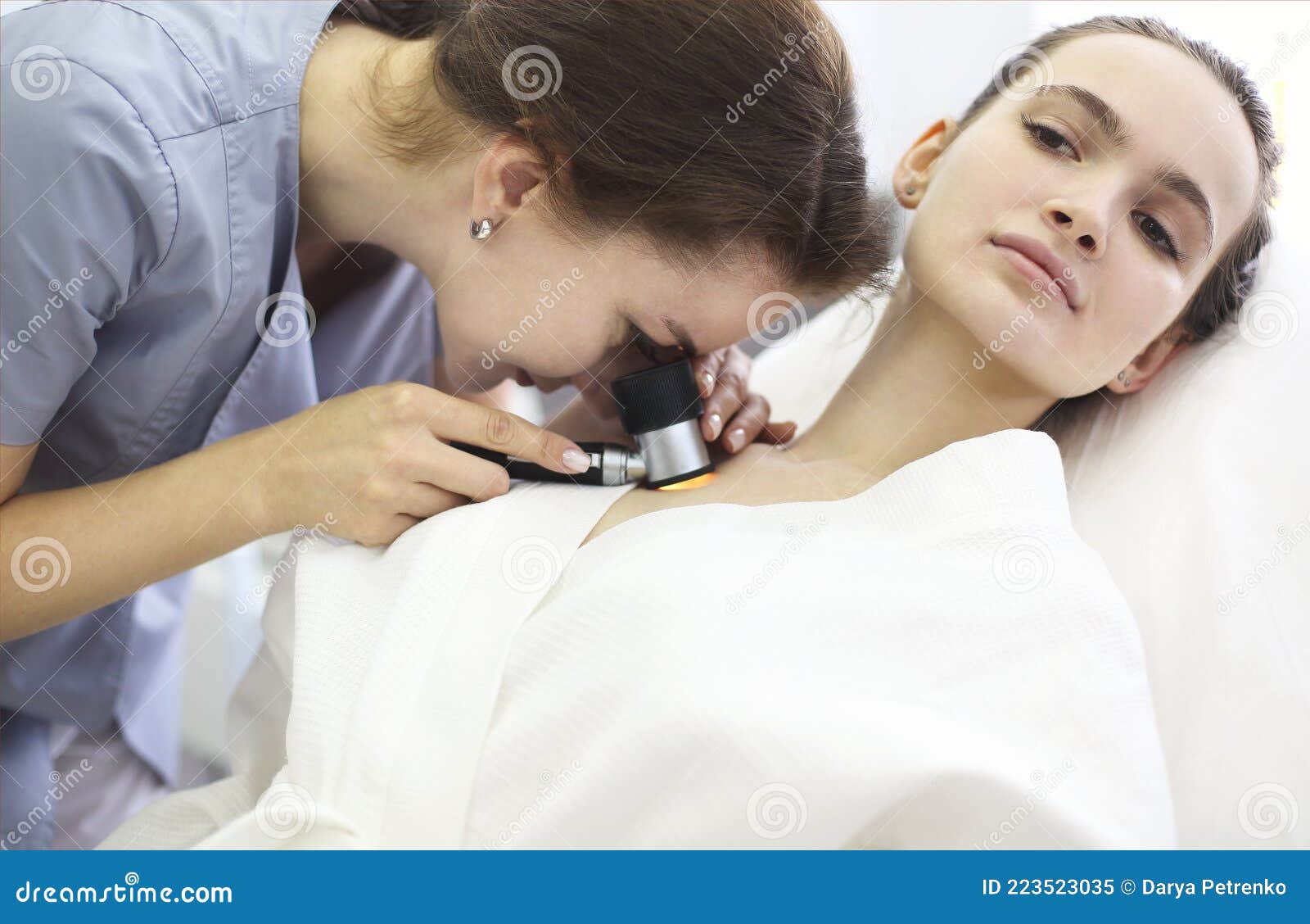 Doctor Using Magnifier during Mole Removal Procedure Stock Image ...