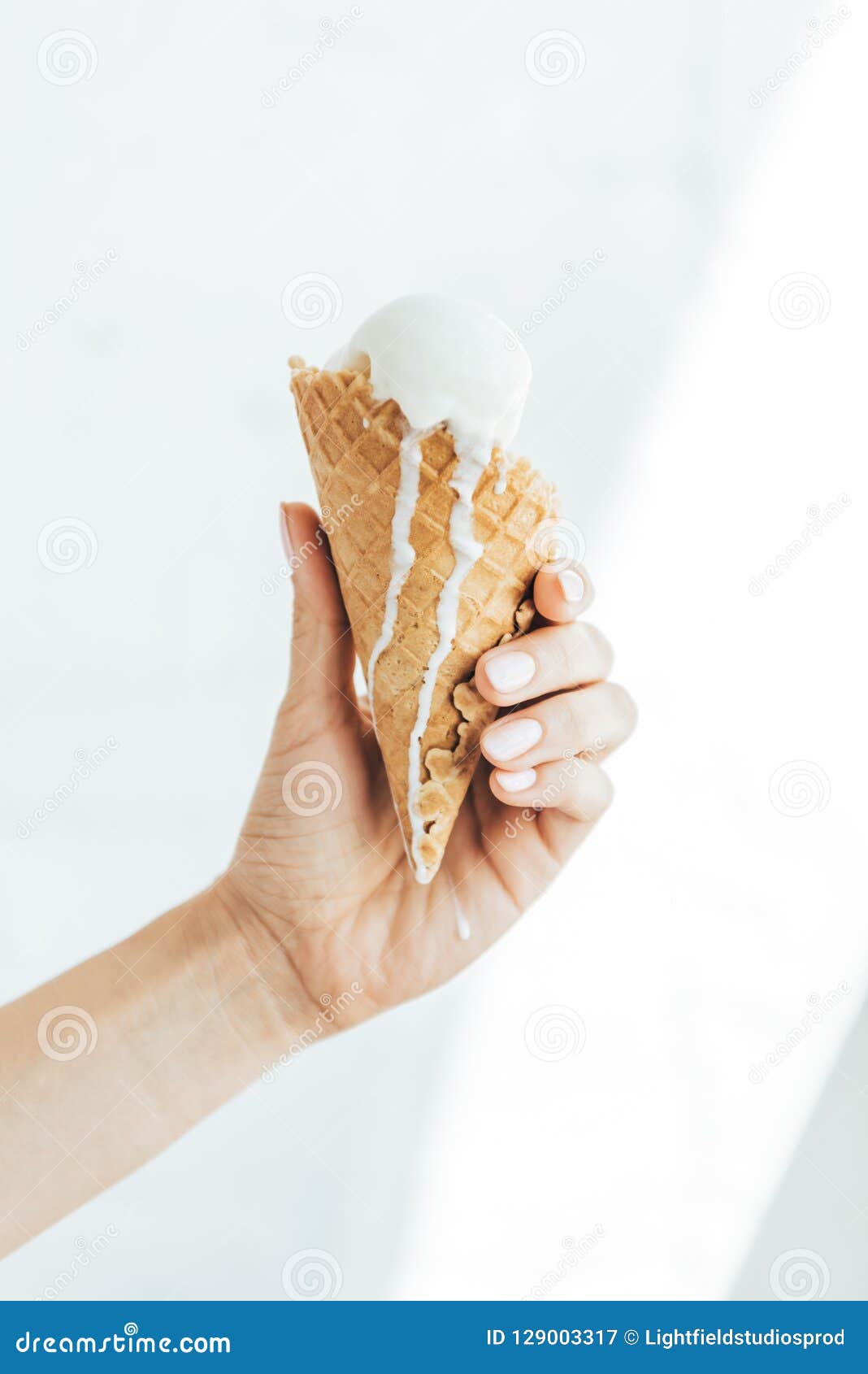 Cropped View of Female Hand with Melting Ice Cream Stock Image - Image ...