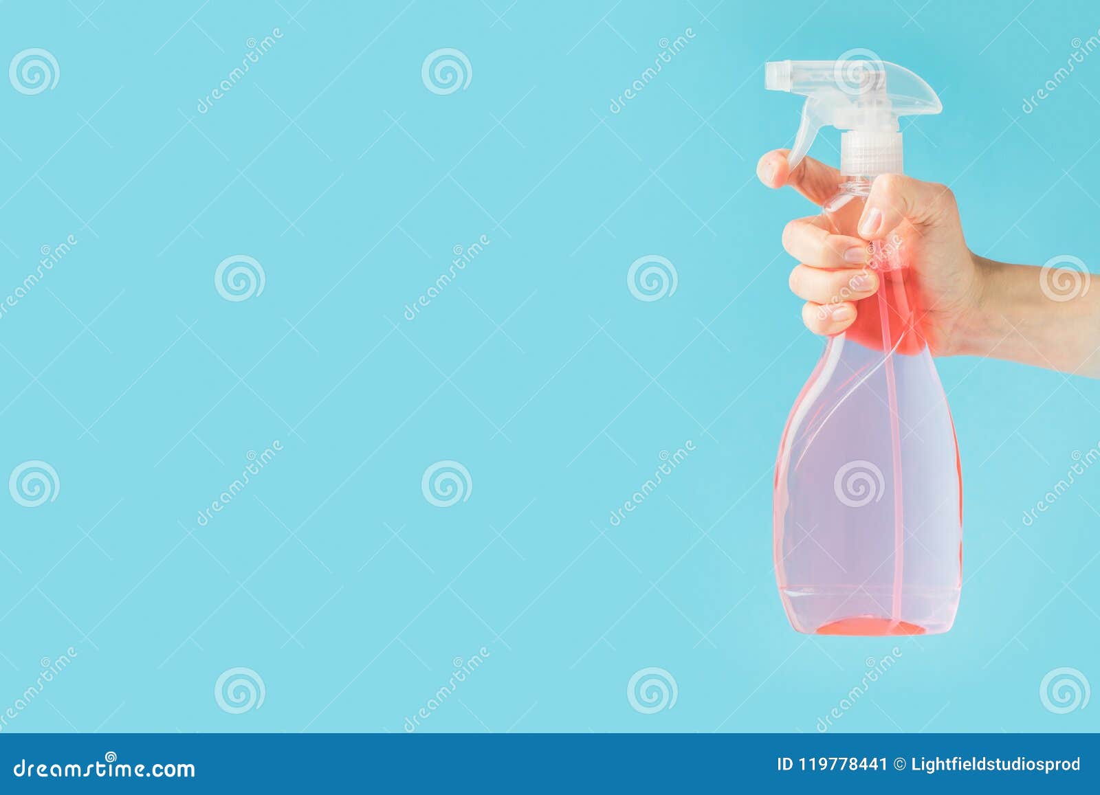 Cropped View of Hand Holding Spray Bottle, Stock Image - Image of woman ...