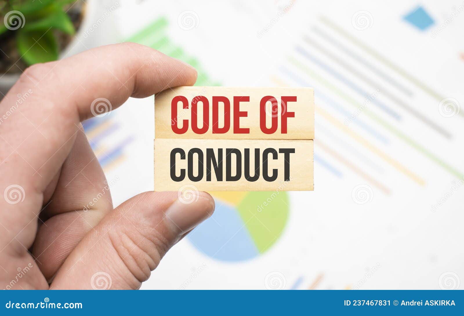 Cropped View of Hands Holding Wooden Cube with Code of Conduct ...