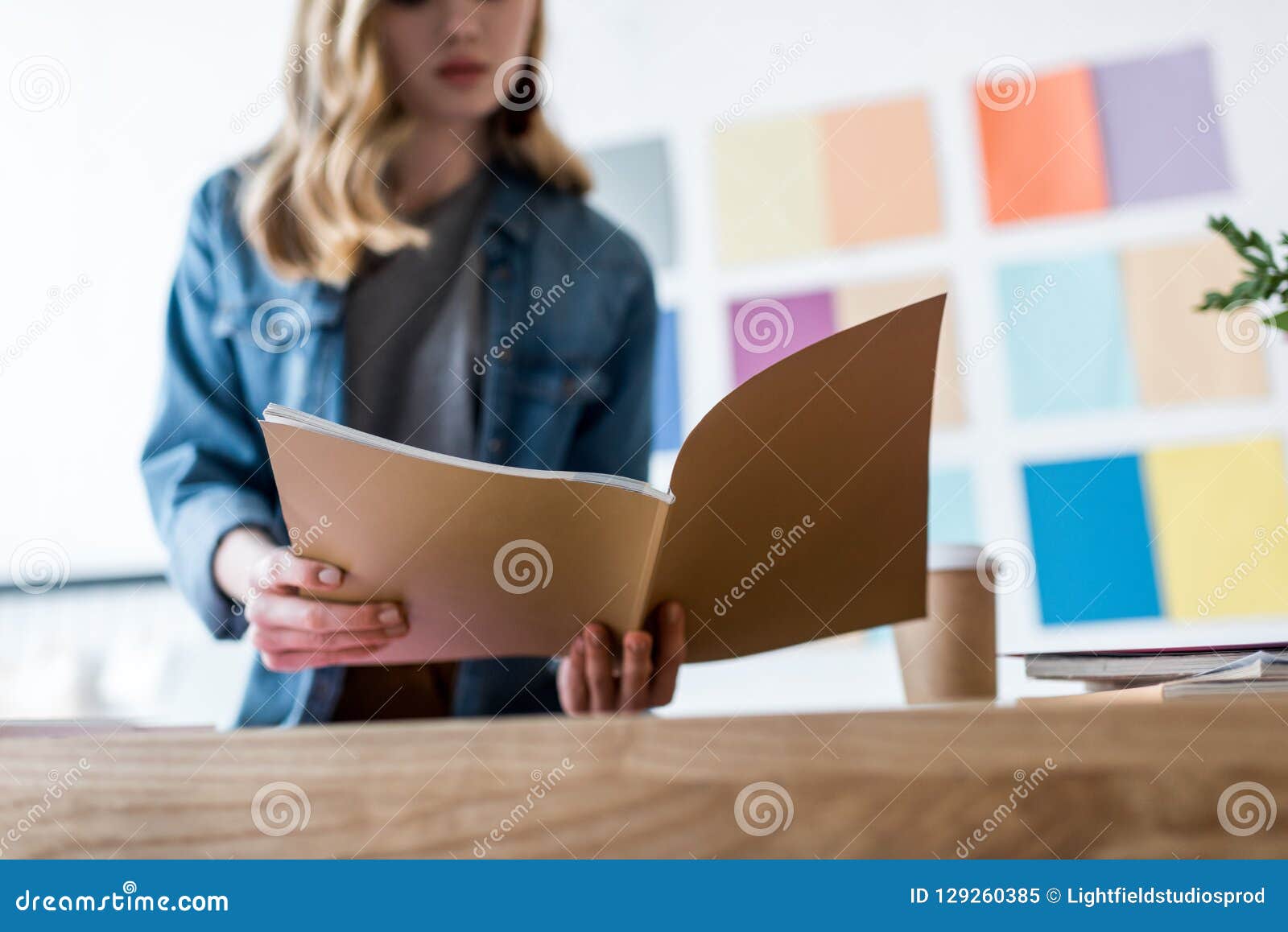 Cropped View of Magazine Editor Working in Modern Office with Color ...