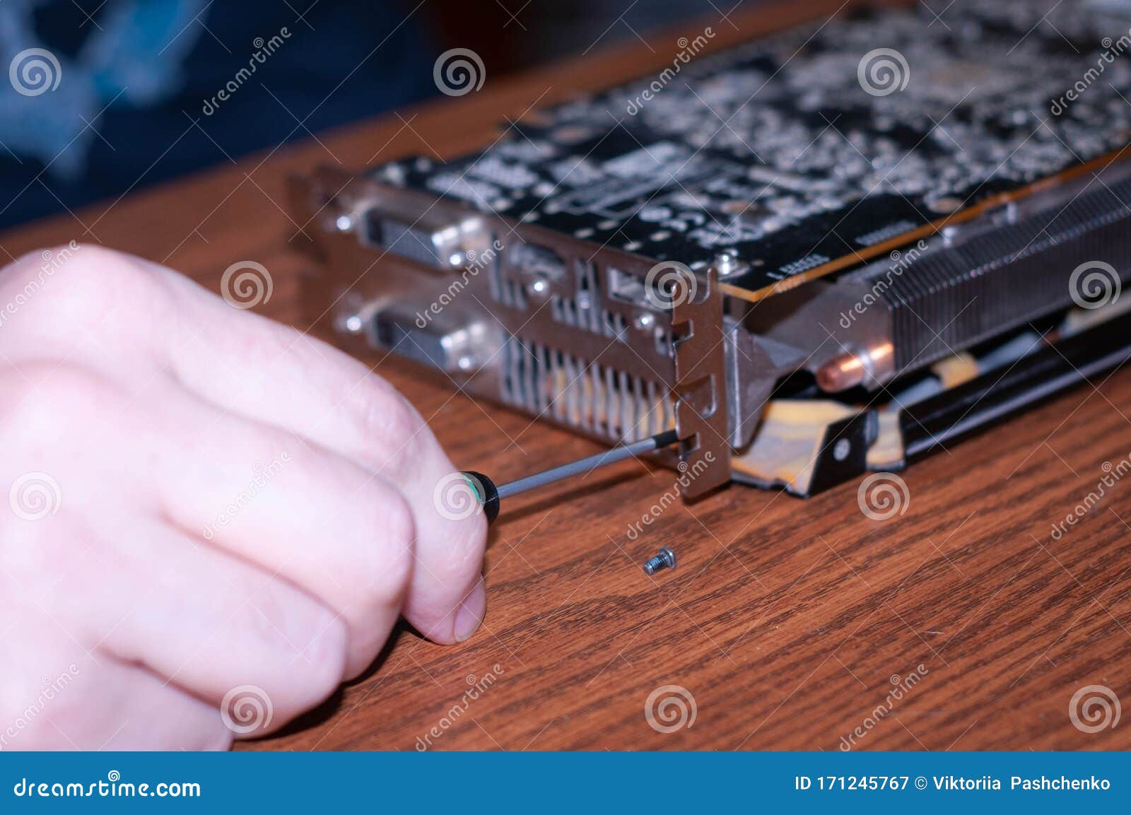 Master Disassemble Graphics Card for Computer on Wooden Surface Stock ...